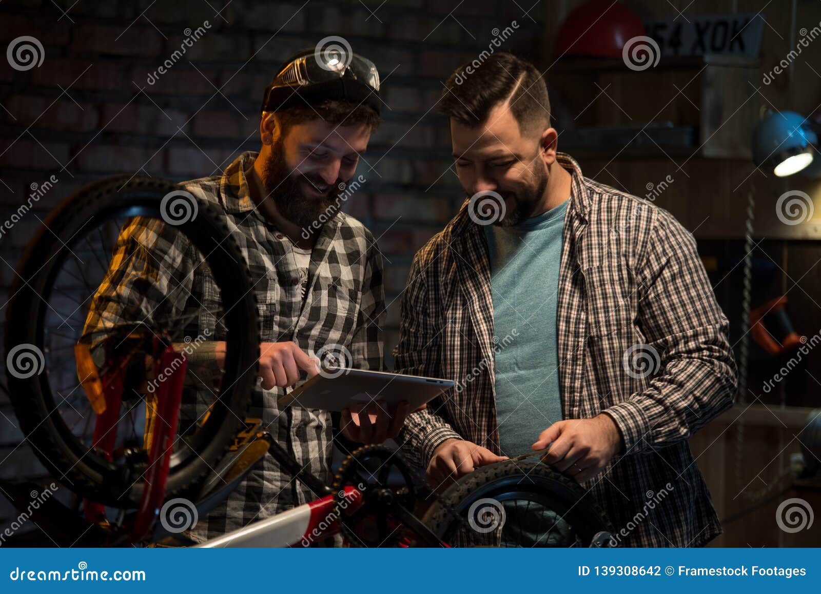 Two Mechanic Talking in a Workshop Stock Photo - Image of discussing ...
