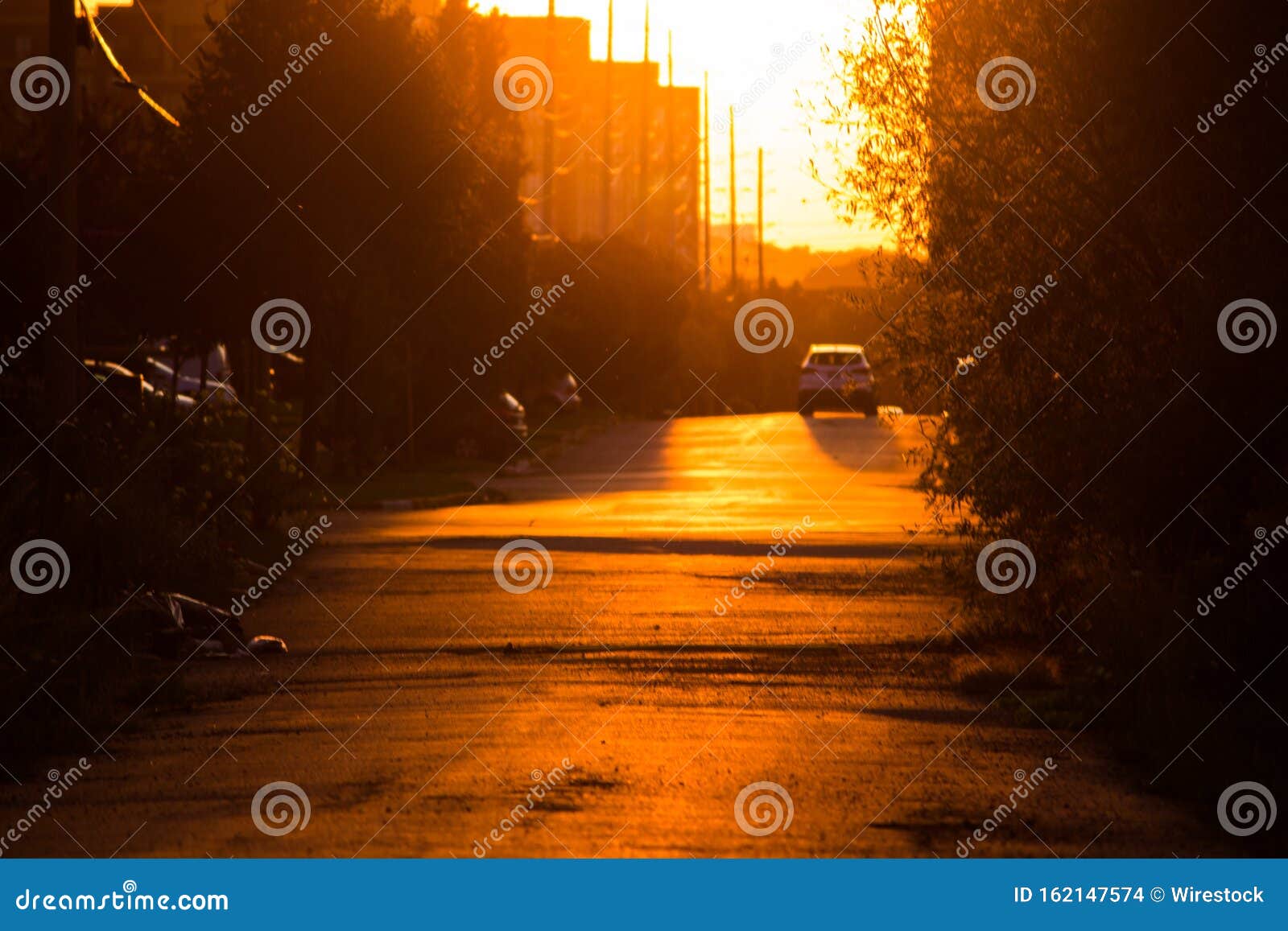 Shot of a White Car Going Down the Road during Sunset Stock Photo ...