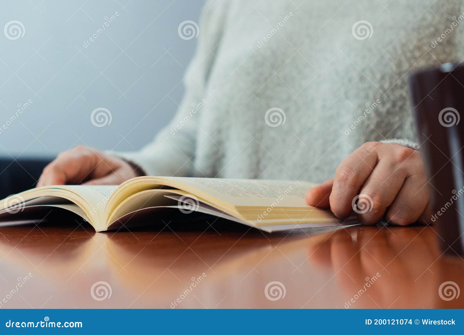 Shot of a Woman S Hand with an Open Book Stock Photo - Image of sofa ...