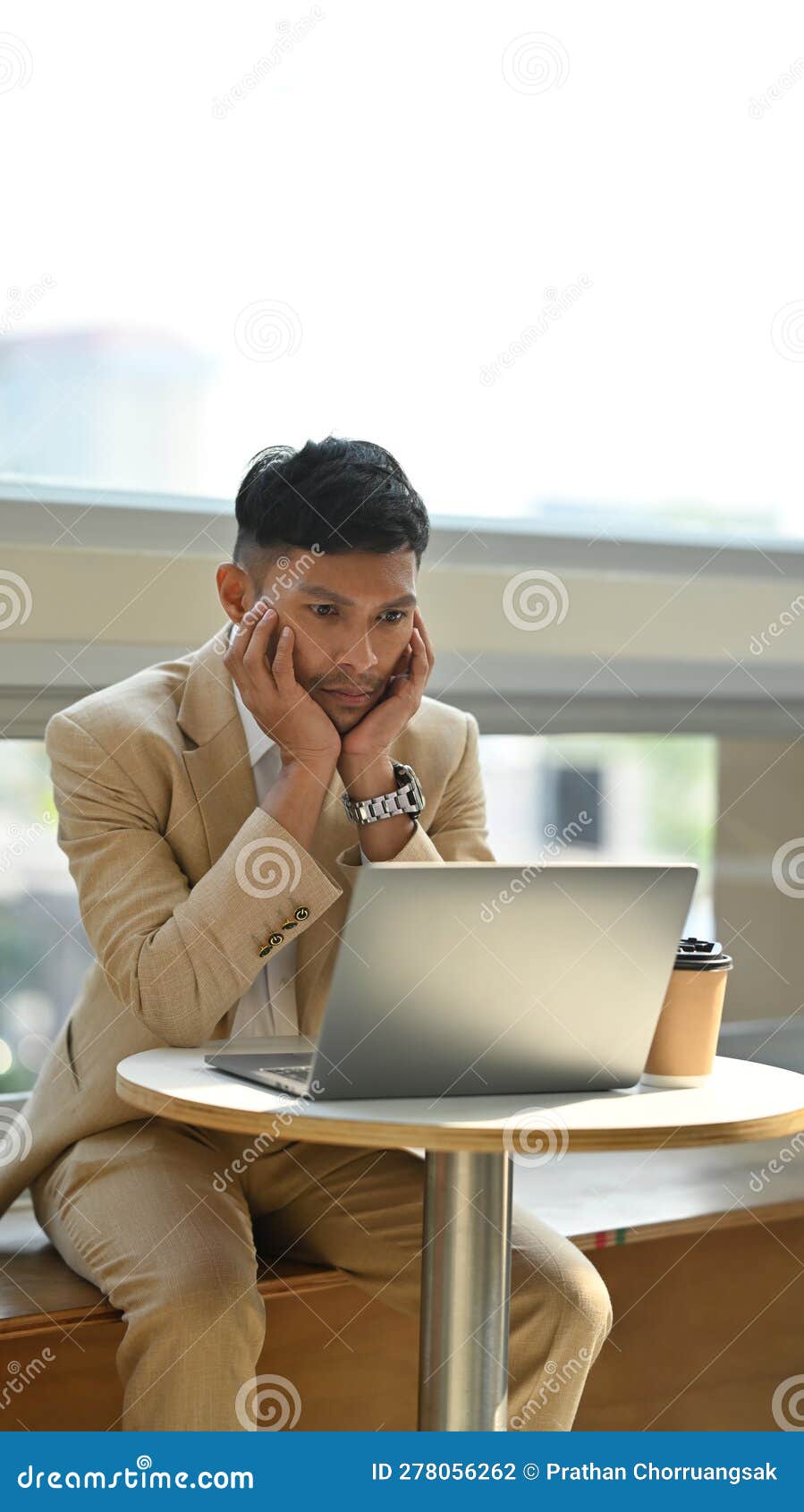 Shot of a Young Businessman Looking at Laptop Screen, Thinking of ...