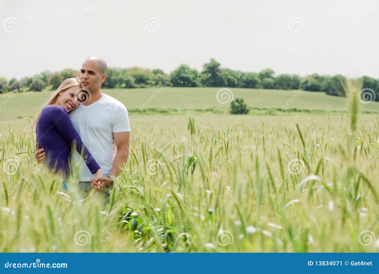 Shot of Young Couple Hugging and Holding Hands Stock Image - Image of ...