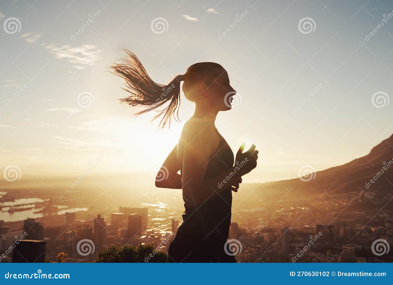 Just Keep Running. Shot of a Young Runner Training Outdoors. Stock ...