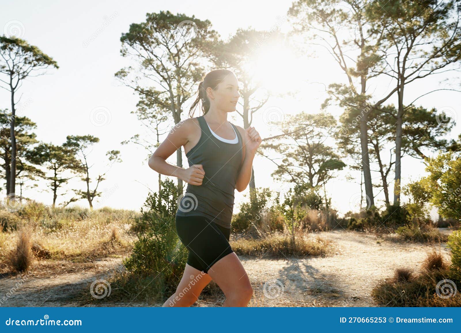 She Loves Trail Running. Shot of a Young Runner Training Outdoors ...