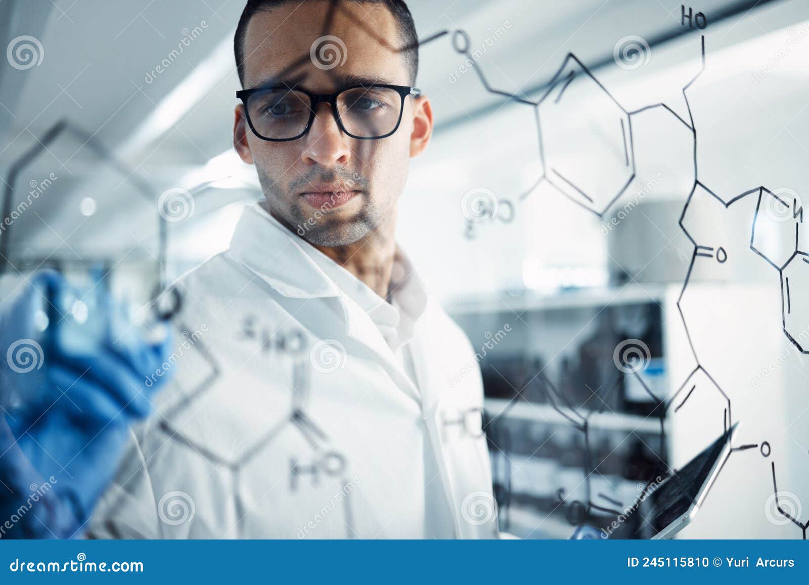 Scientists Keep it Super Smart. Shot of a Young Scientist Solving ...