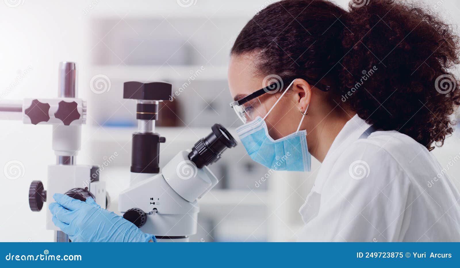 The Solution Must Be Here Somewhere. Shot of a Young Scientist Using a ...