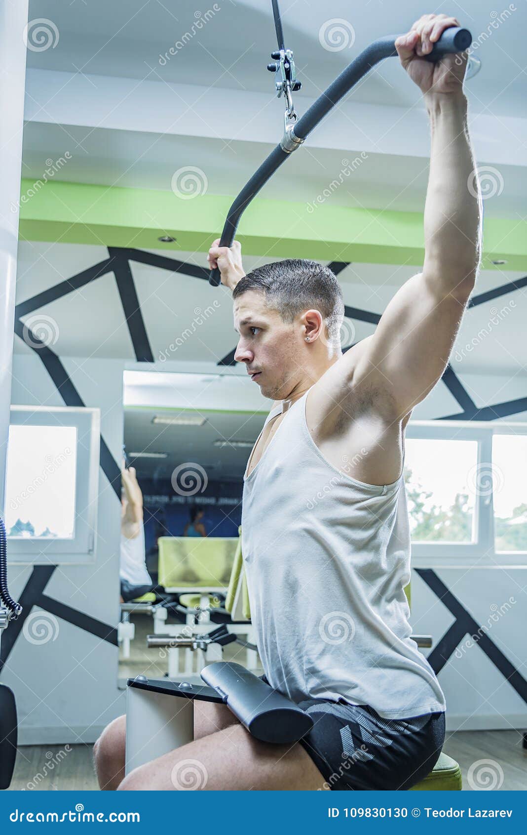 Shoulder Pull Down Exercise Stock Photo - Image of equipment, pulldown ...