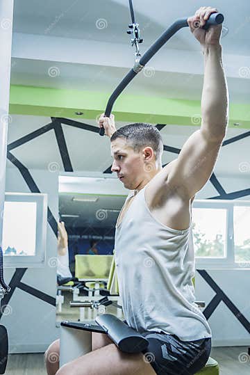 Shoulder Pull Down Exercise Stock Photo - Image of equipment, pulldown ...