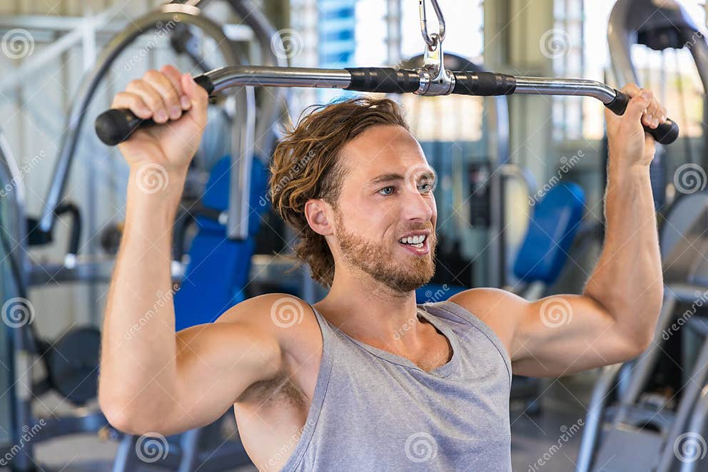 Shoulder Pull Down Machine. Fitness Man Working Out Lat Pulldown ...