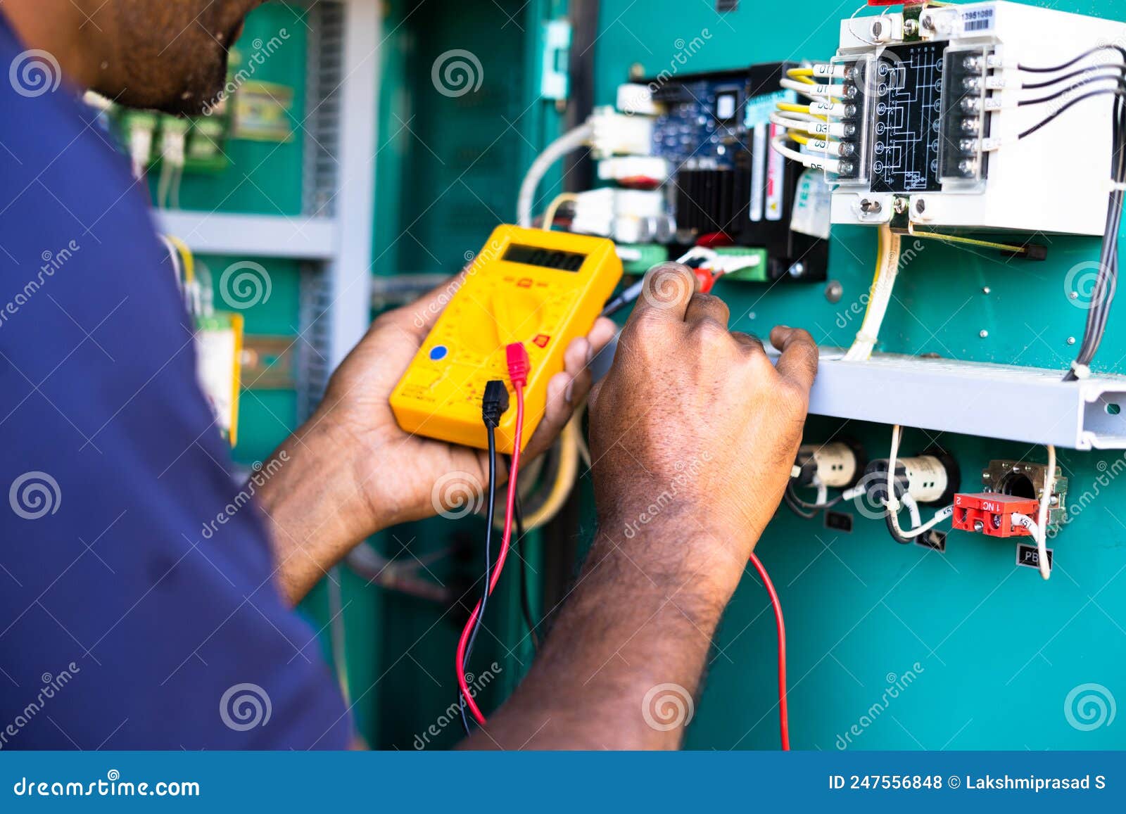 Shoulder Shot Electrical Engineer or Repairman Checking Connection ...