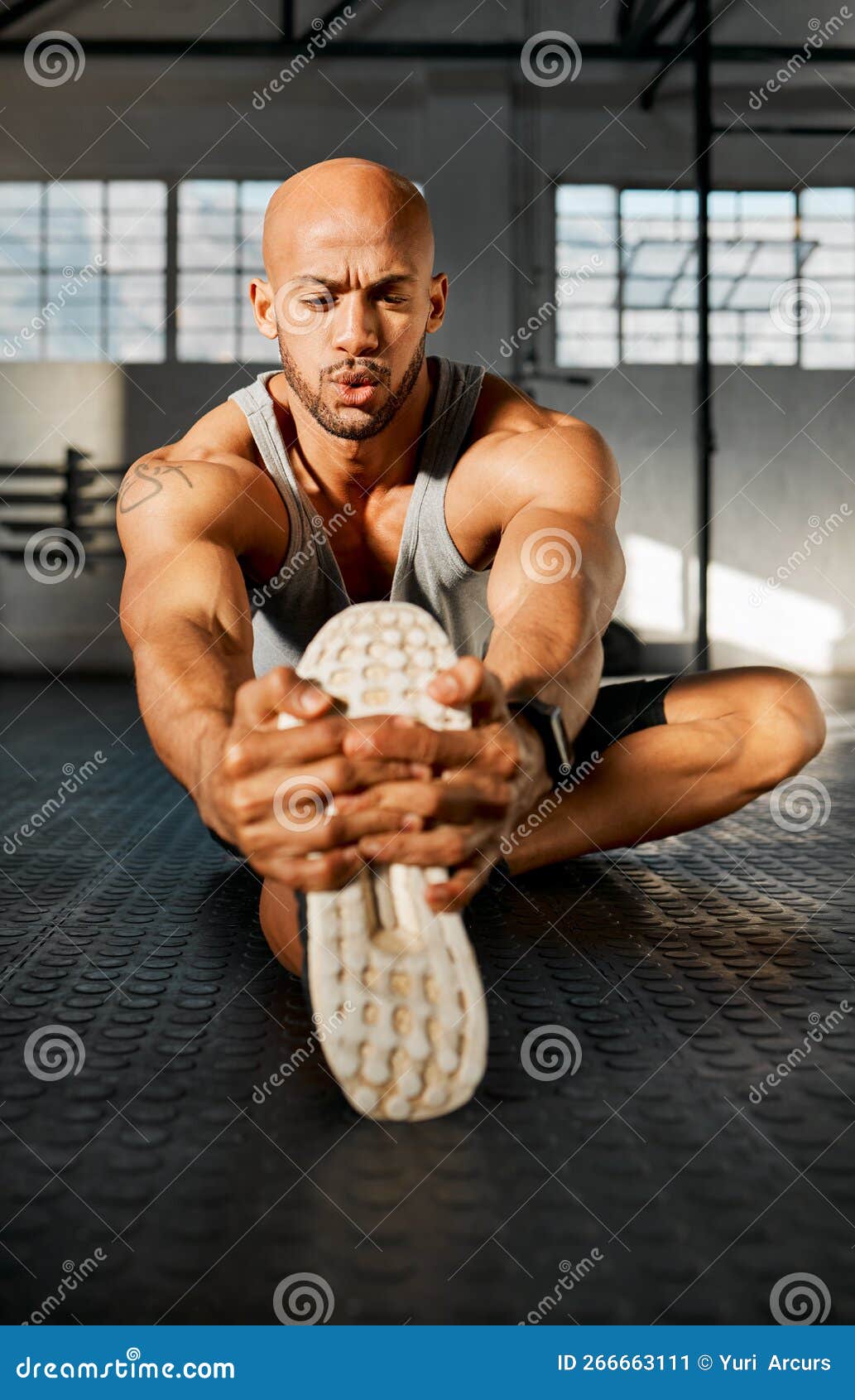 It Shouldnt Feel Strenuous. a Young Man Stretching His Legs before a ...