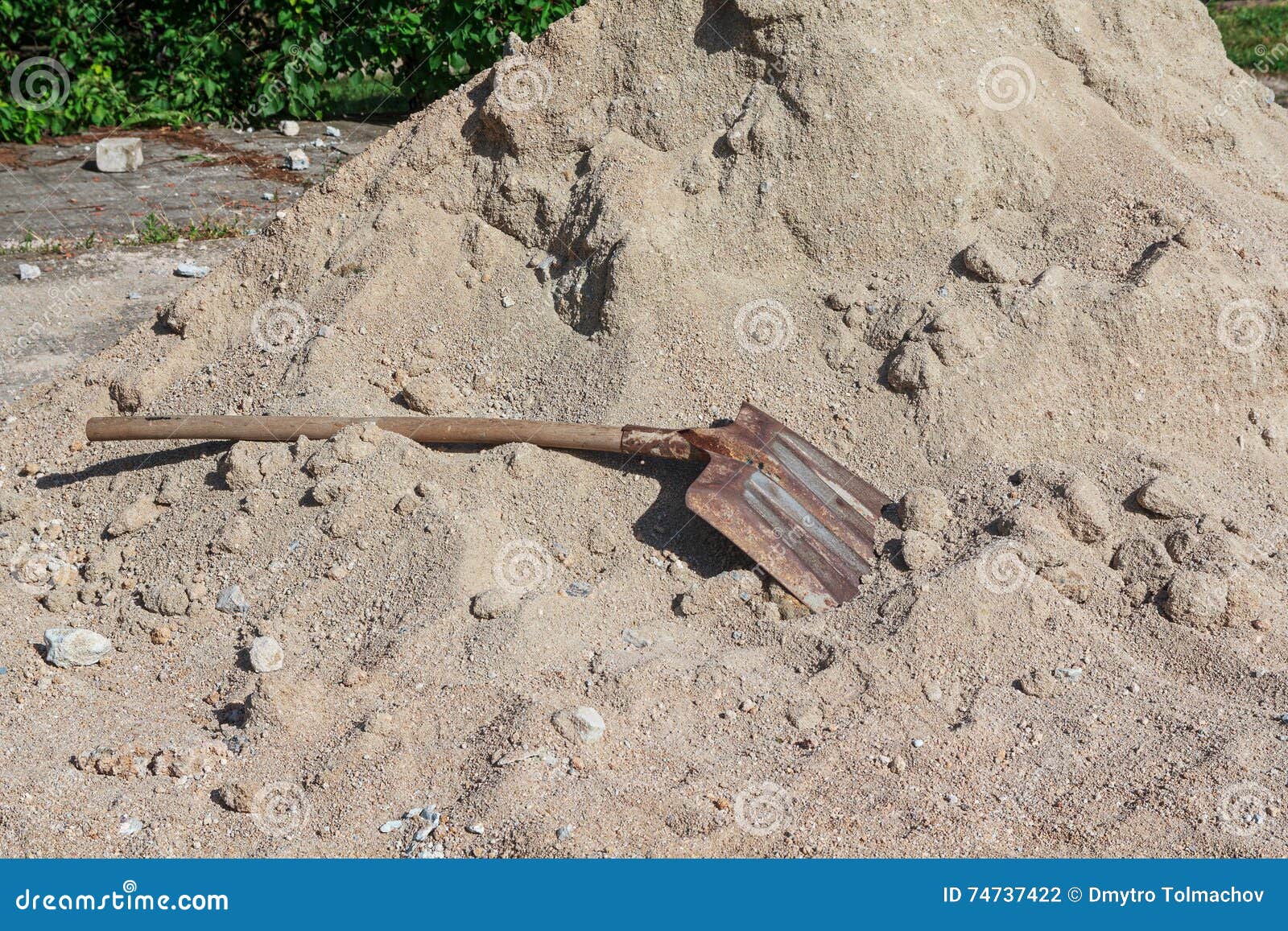 Shovel digging into pile stock photo. Image of ground - 74737422