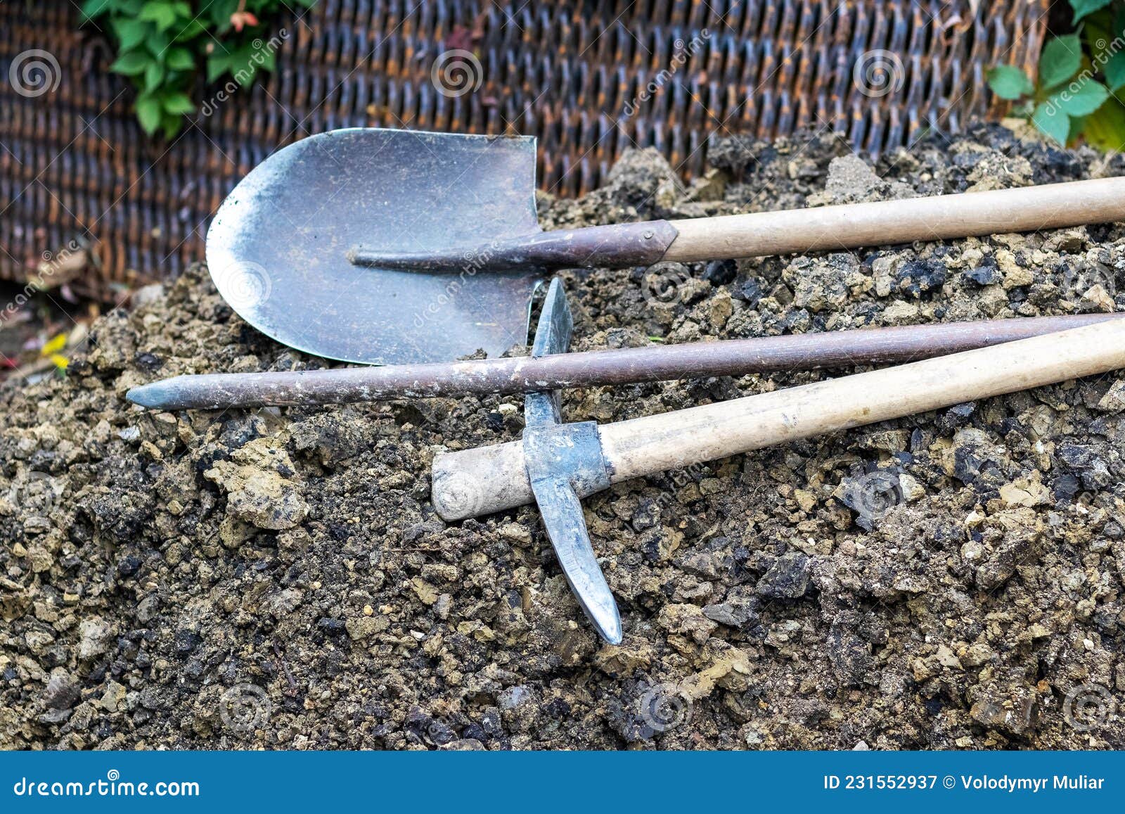 Shovel, Pickaxe and Scrap on a Pile of Earth. Trench Digging Tools ...