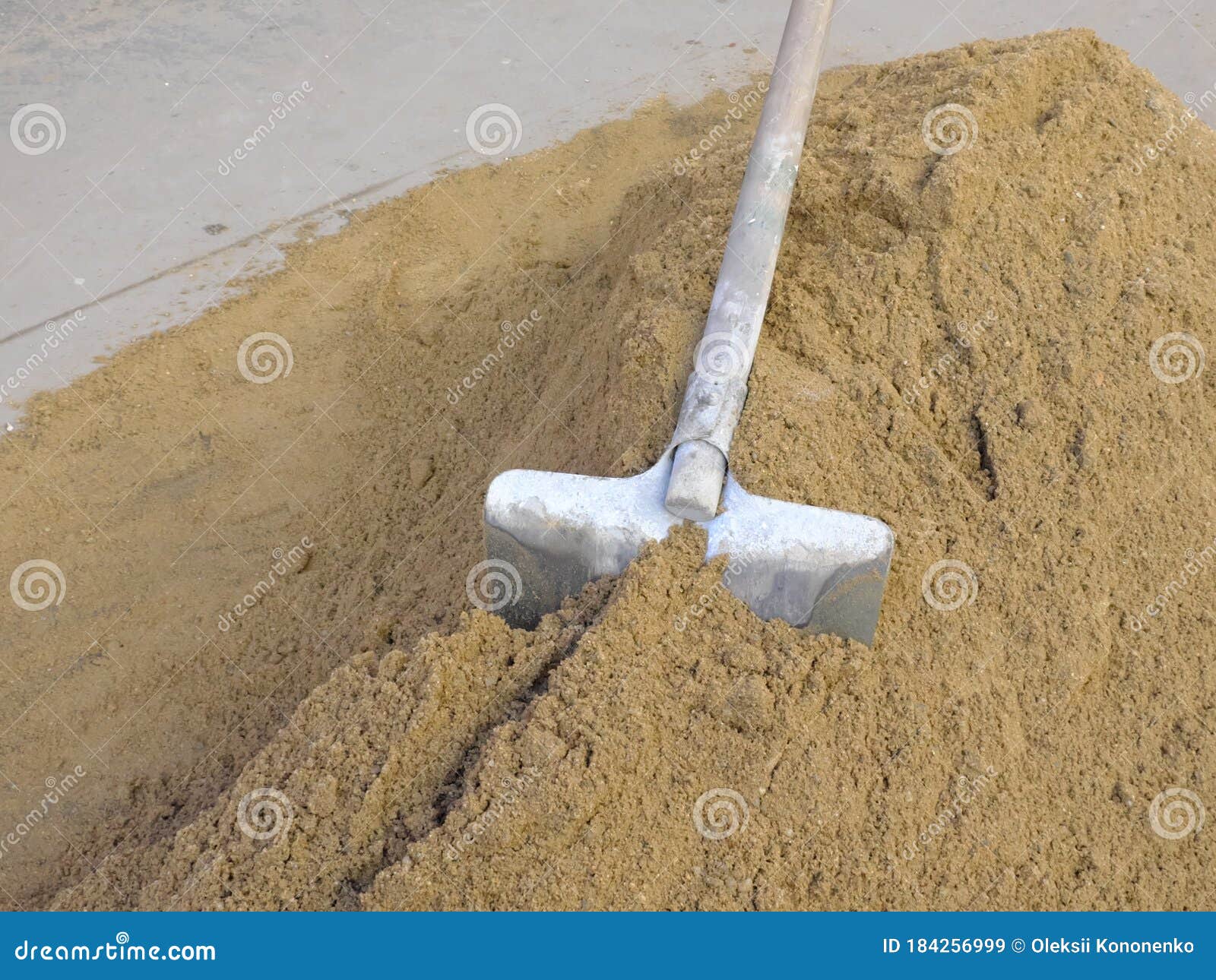 A Shovel Sticks Out in a Pile of Sand Stock Image - Image of pile, heap ...