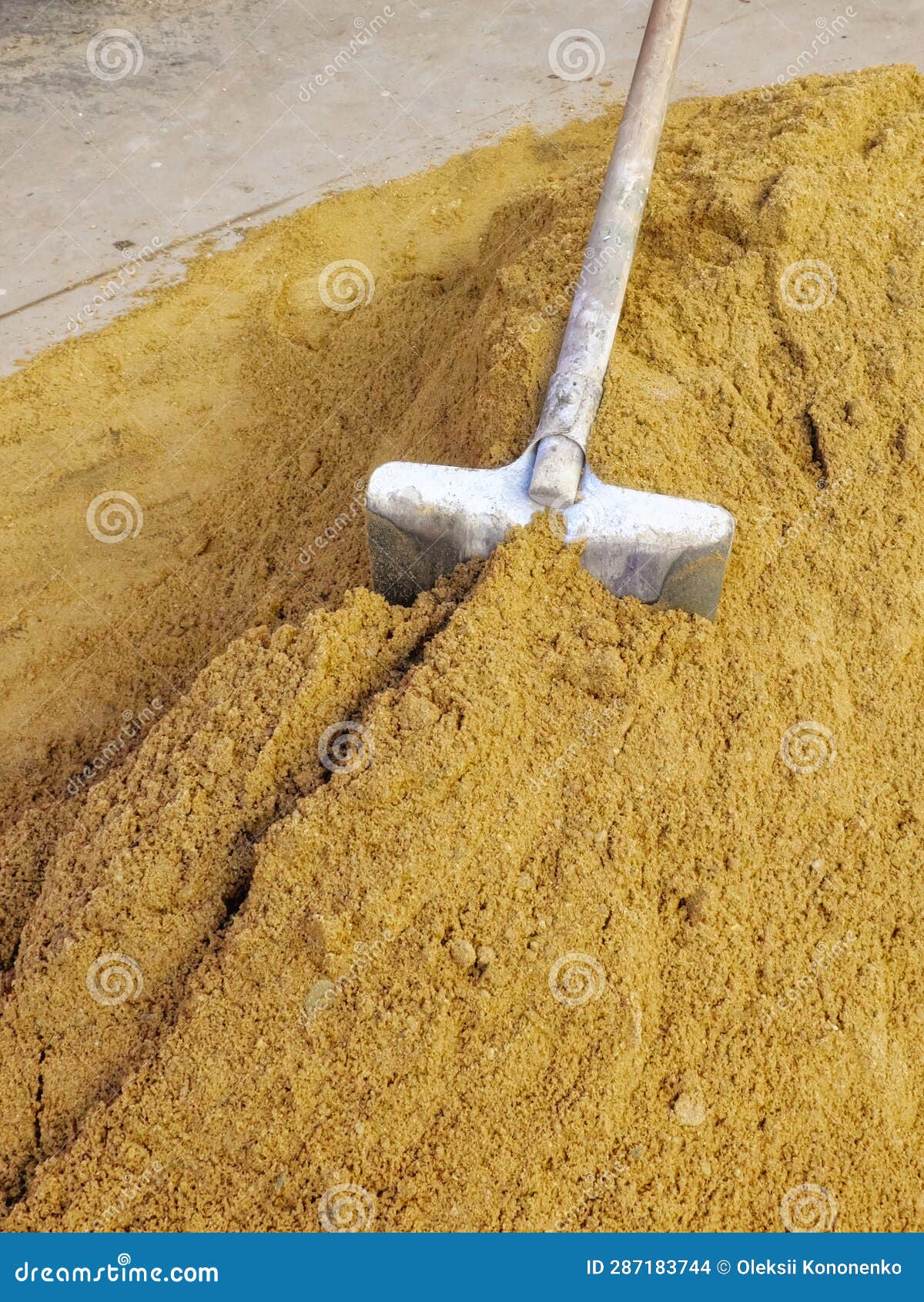 A Shovel Sticks Out in a Pile of Sand Stock Photo - Image of handle ...