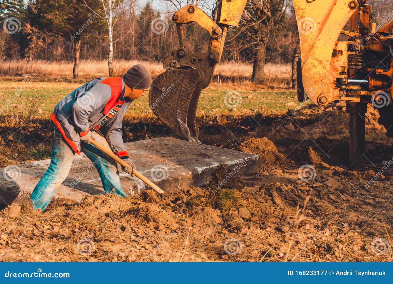 Excavator During Laying Drain Pipes And Concrete Manholes For ...