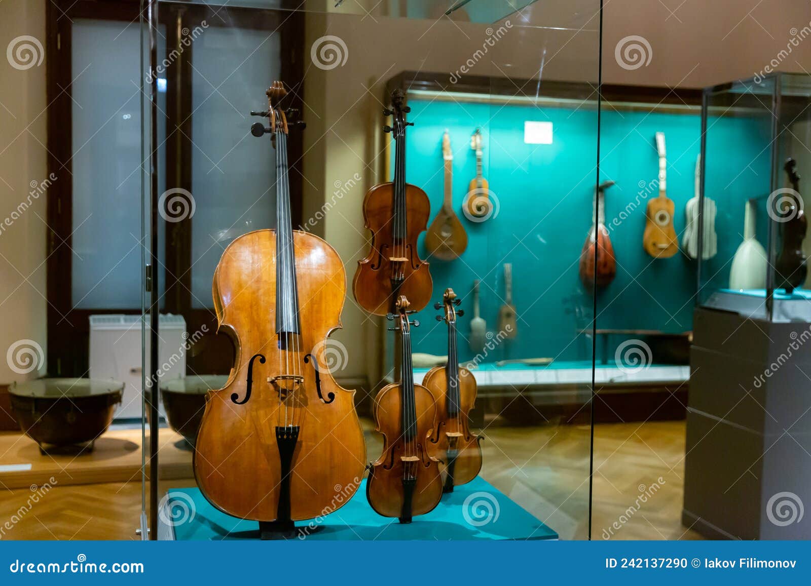 Showcase with Bowed String Instruments in Weltmuseum Wien, Austria ...