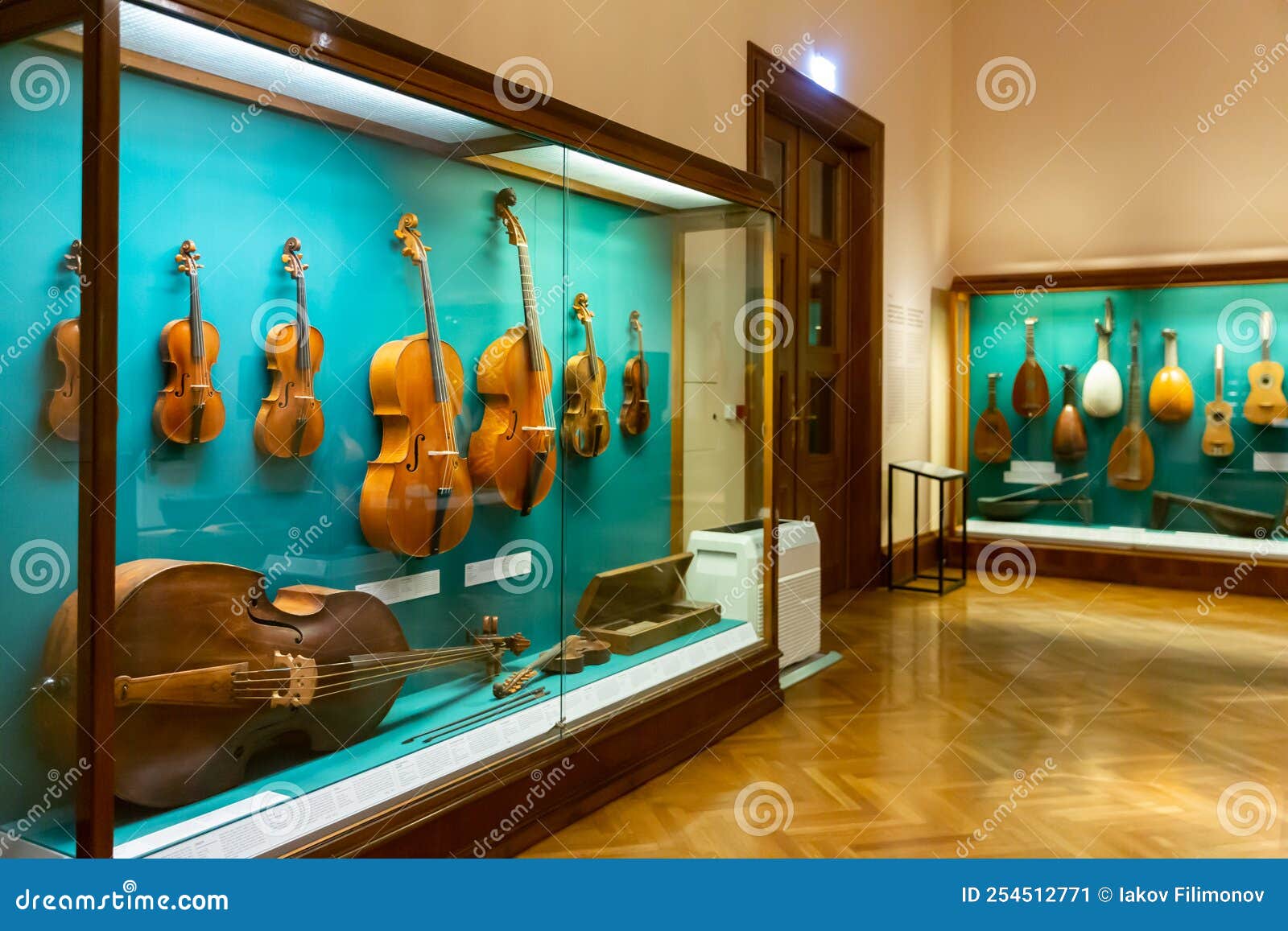 Showcase with Bowed String Instruments in Weltmuseum Wien, Austria ...