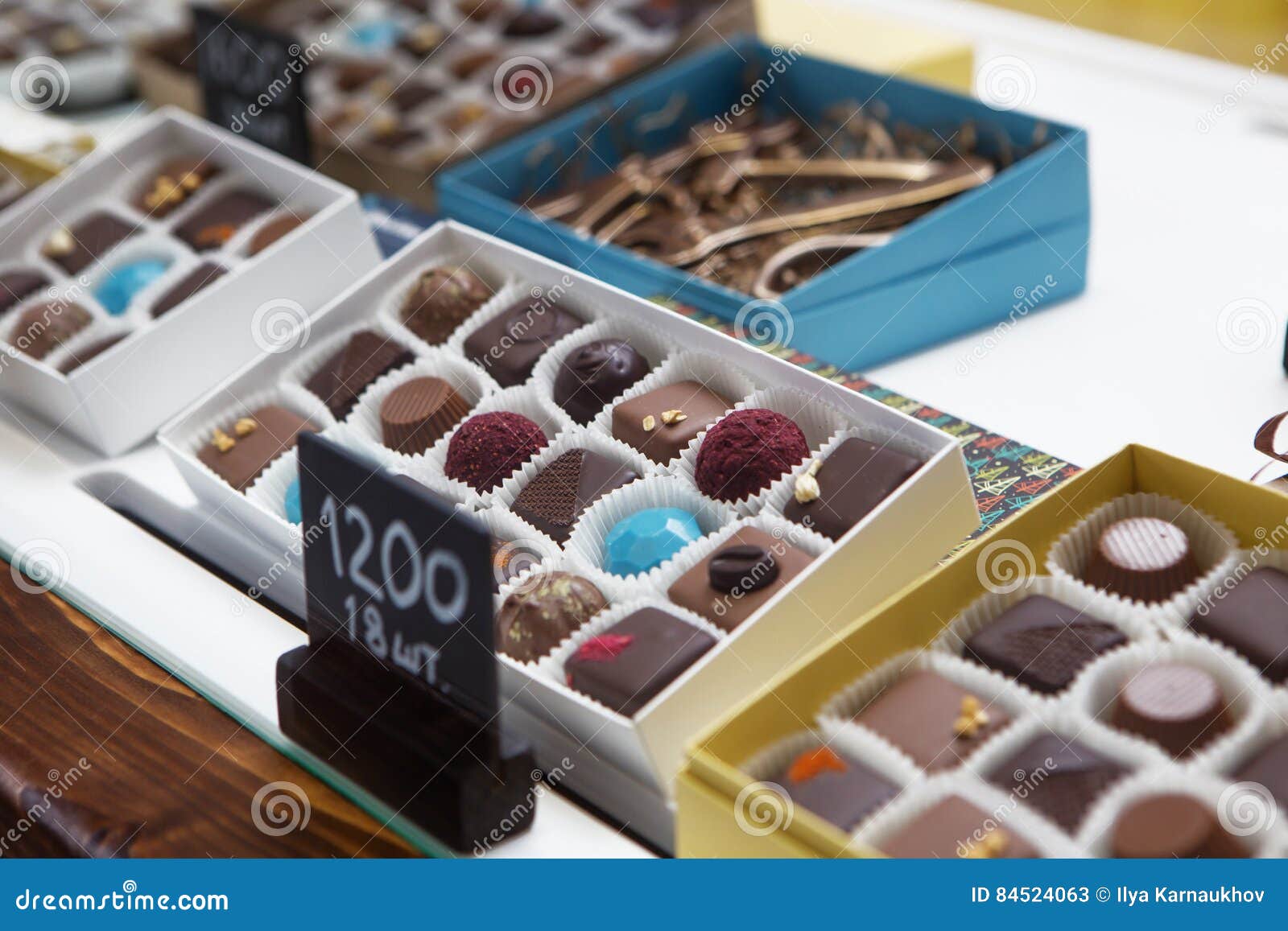 Showcase with chocolate stock image. Image of dessert - 84524063