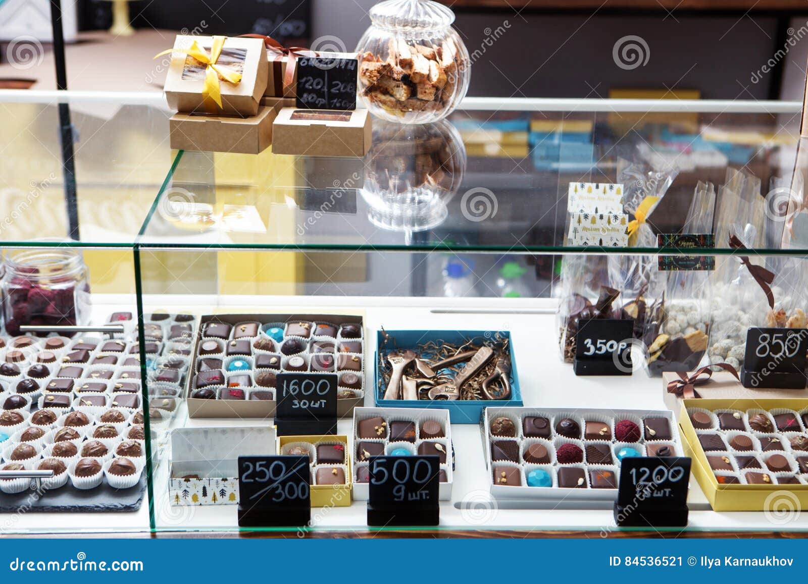 Showcase with chocolate stock image. Image of detail - 84536521