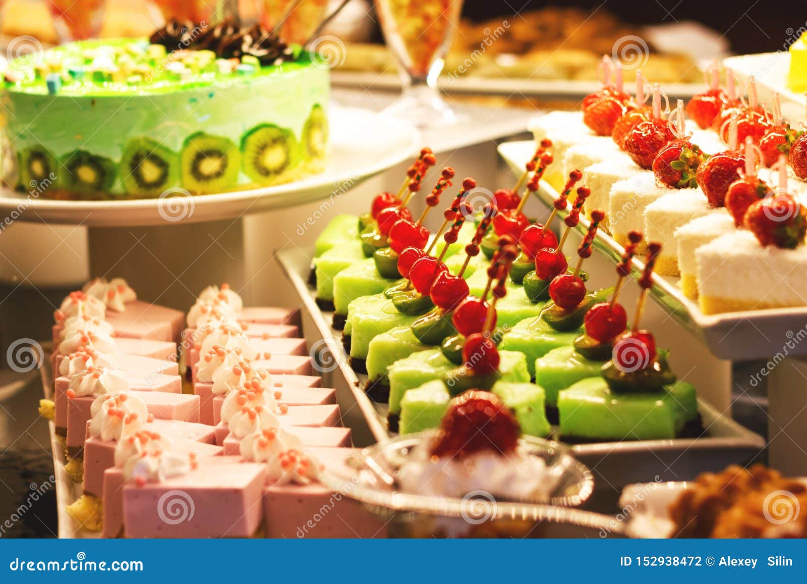 Showcase with many cakes. stock photo. Image of colorful - 152938472