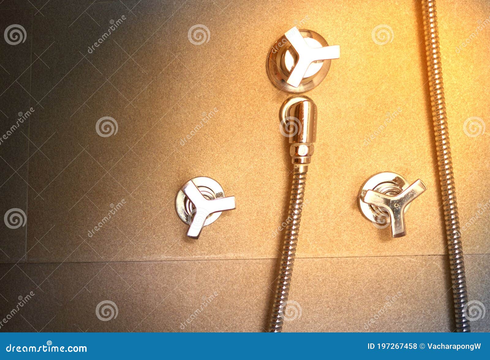 Shower Tap and Silver Faucets on Bath Room Wall with Sun Light with ...