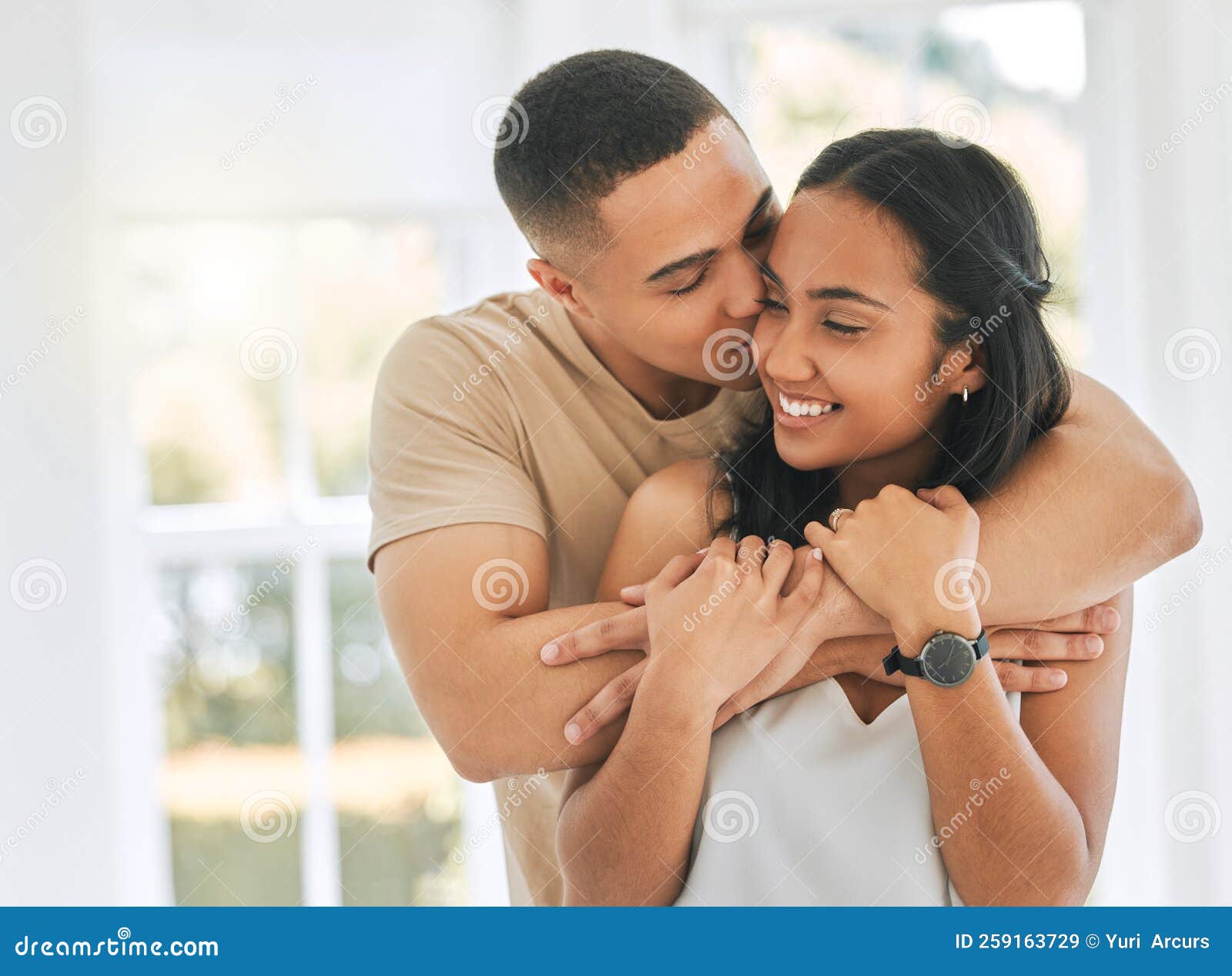 Showering Her with Affection. an Affectionate Young Couple at Home ...