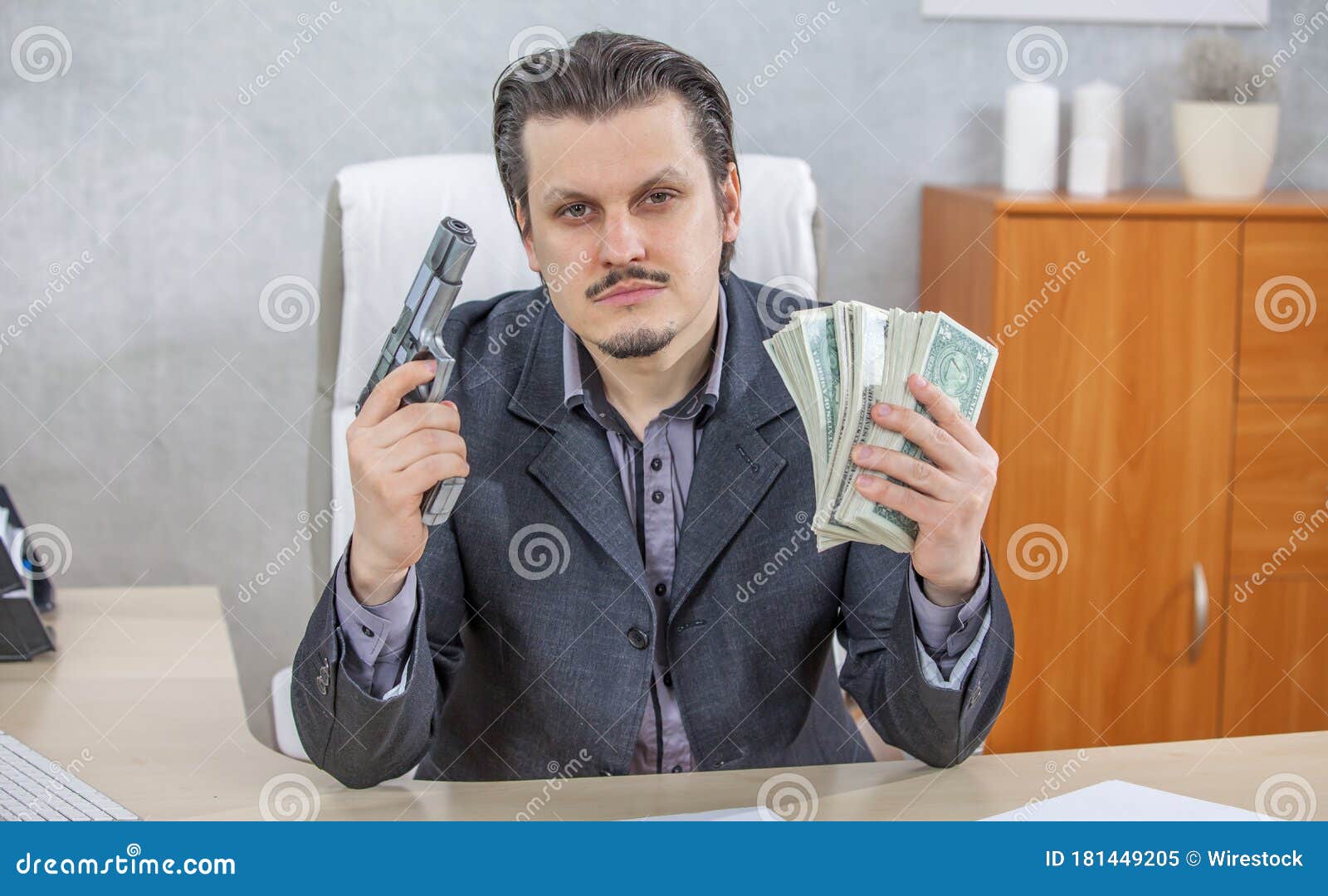 Showing money and a gun stock image. Image of currency - 181449205