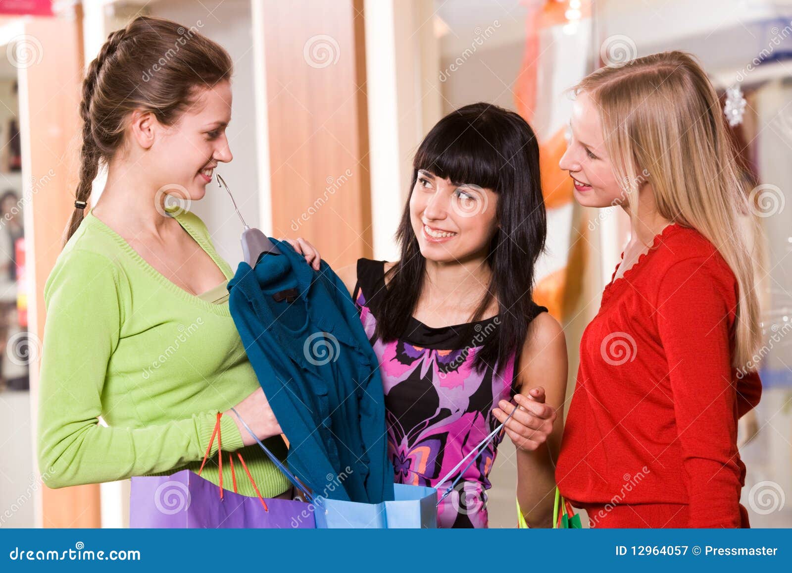 Showing new clothes stock image. Image of adult, cheerful - 12964057