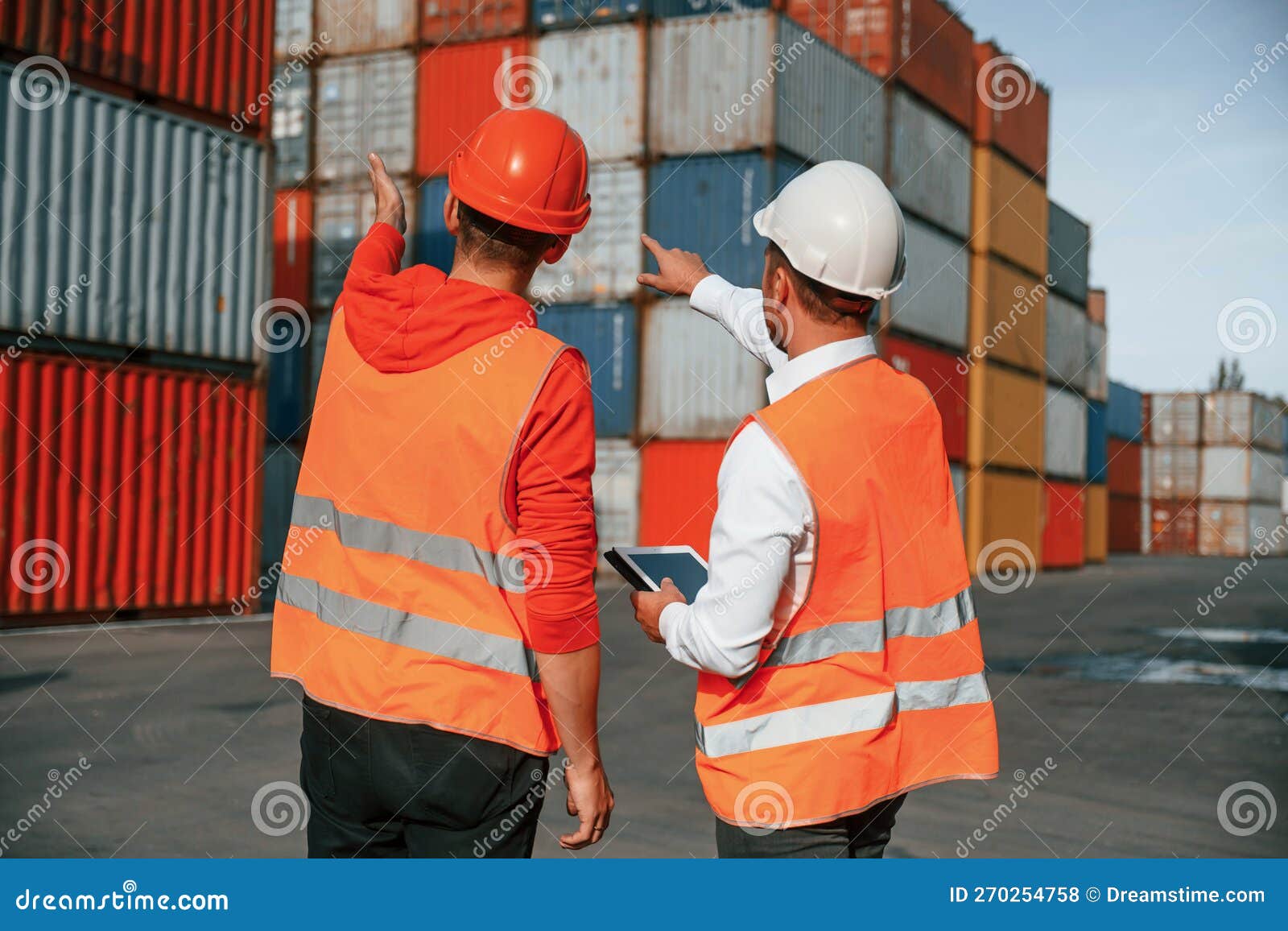 Showing the Objects. Two Male Workers is on the Location with ...