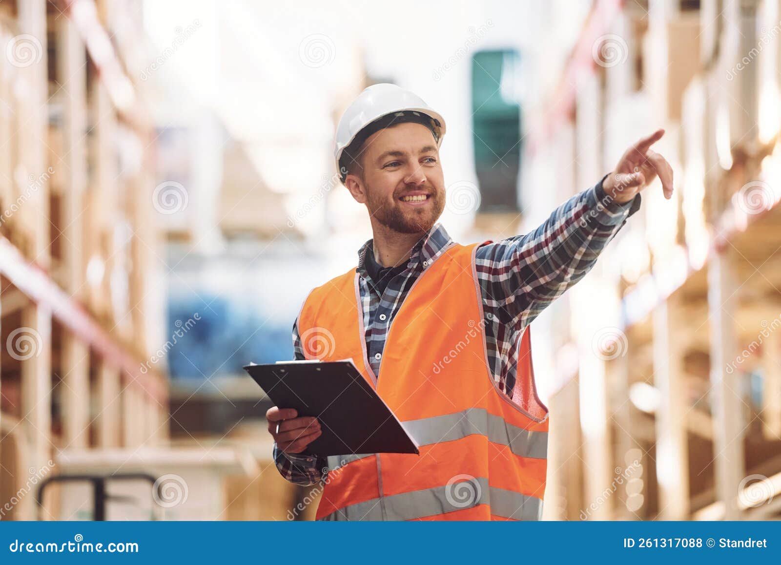 Showing Where To Place the Object. Employee in Uniform is Working in ...