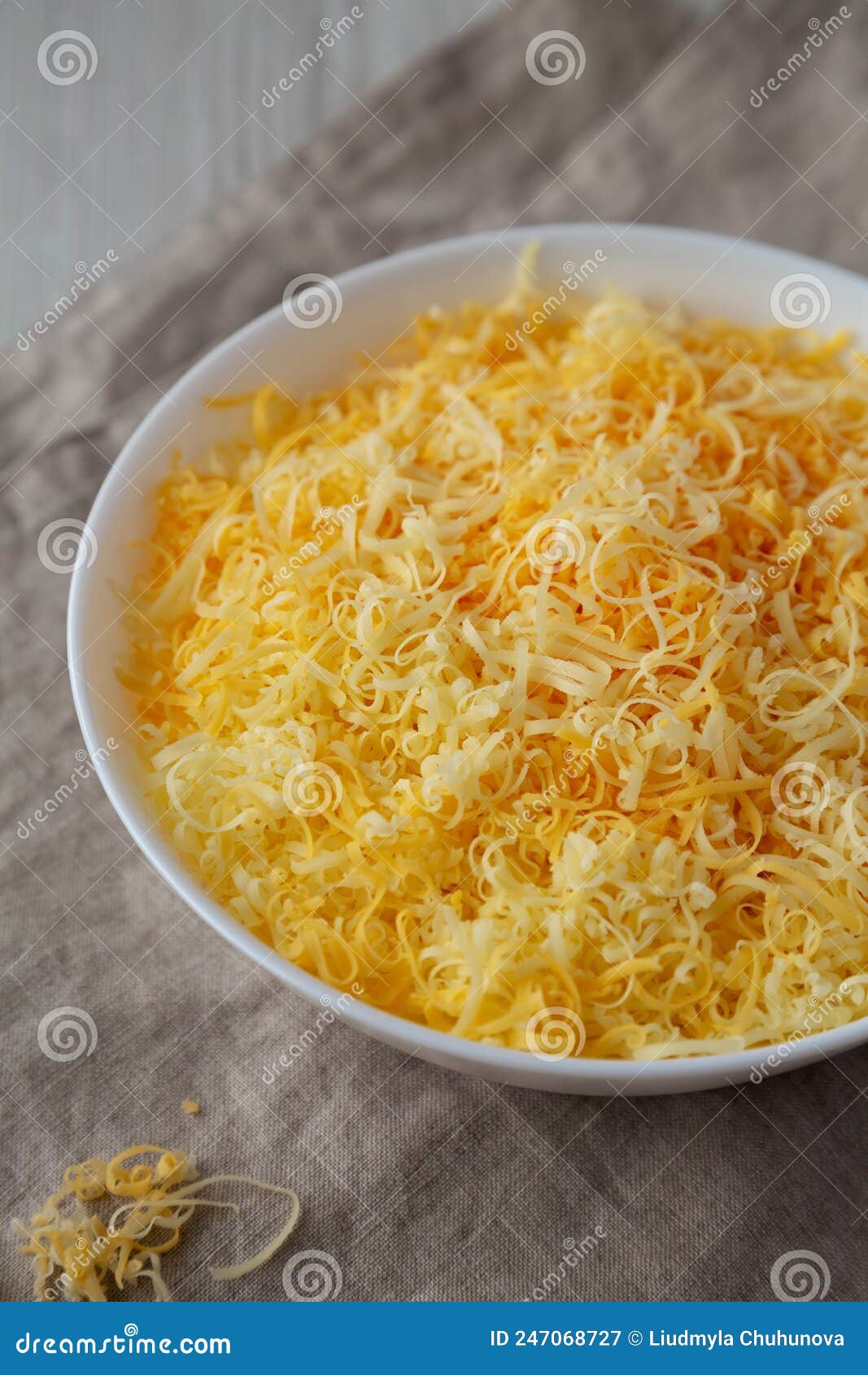 Shredded Mexican Cheese Mix in a White Bowl, Low Angle View Stock Image ...