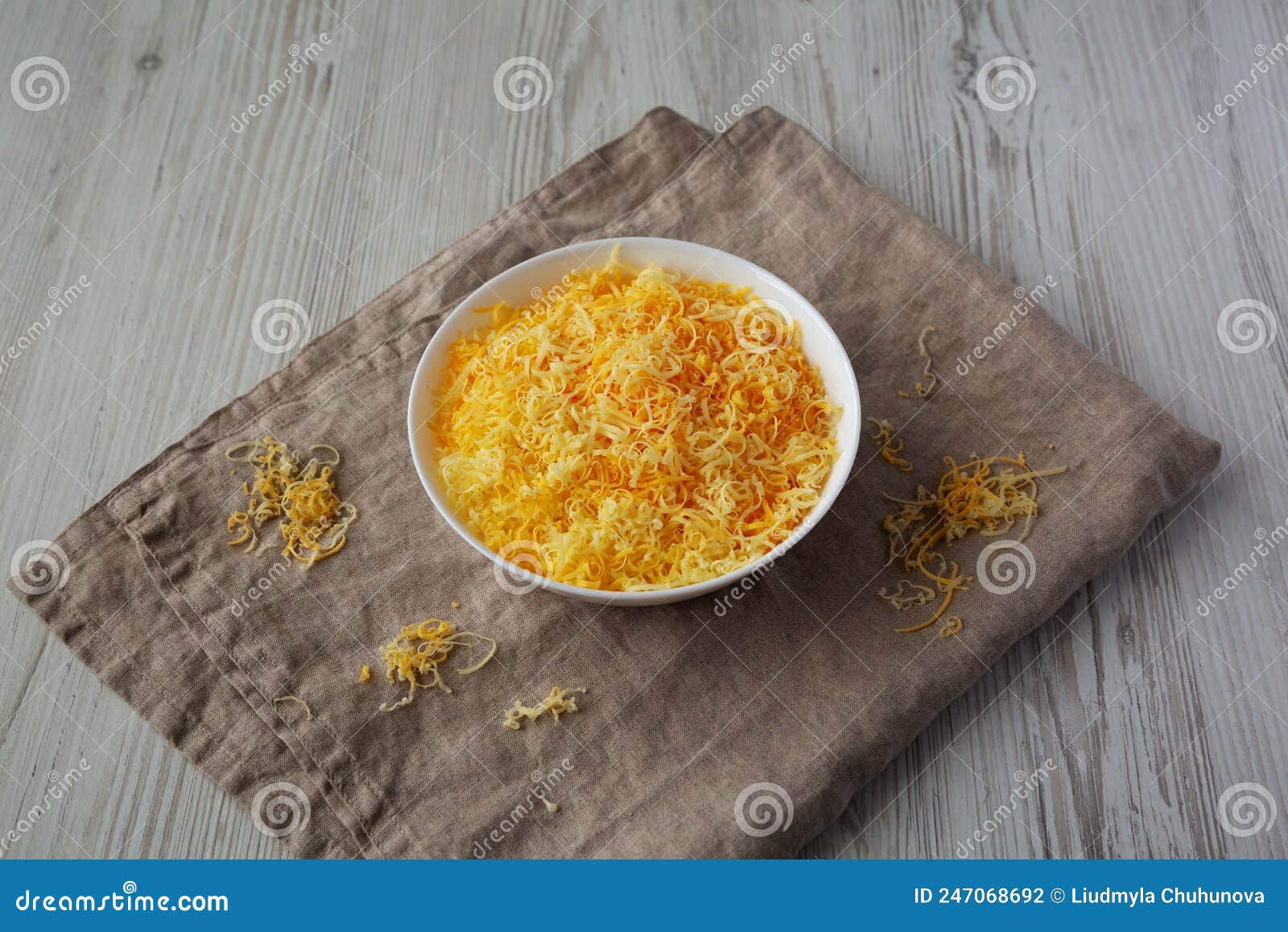 Shredded Mexican Cheese Mix in a White Bowl, Side View Stock Photo ...