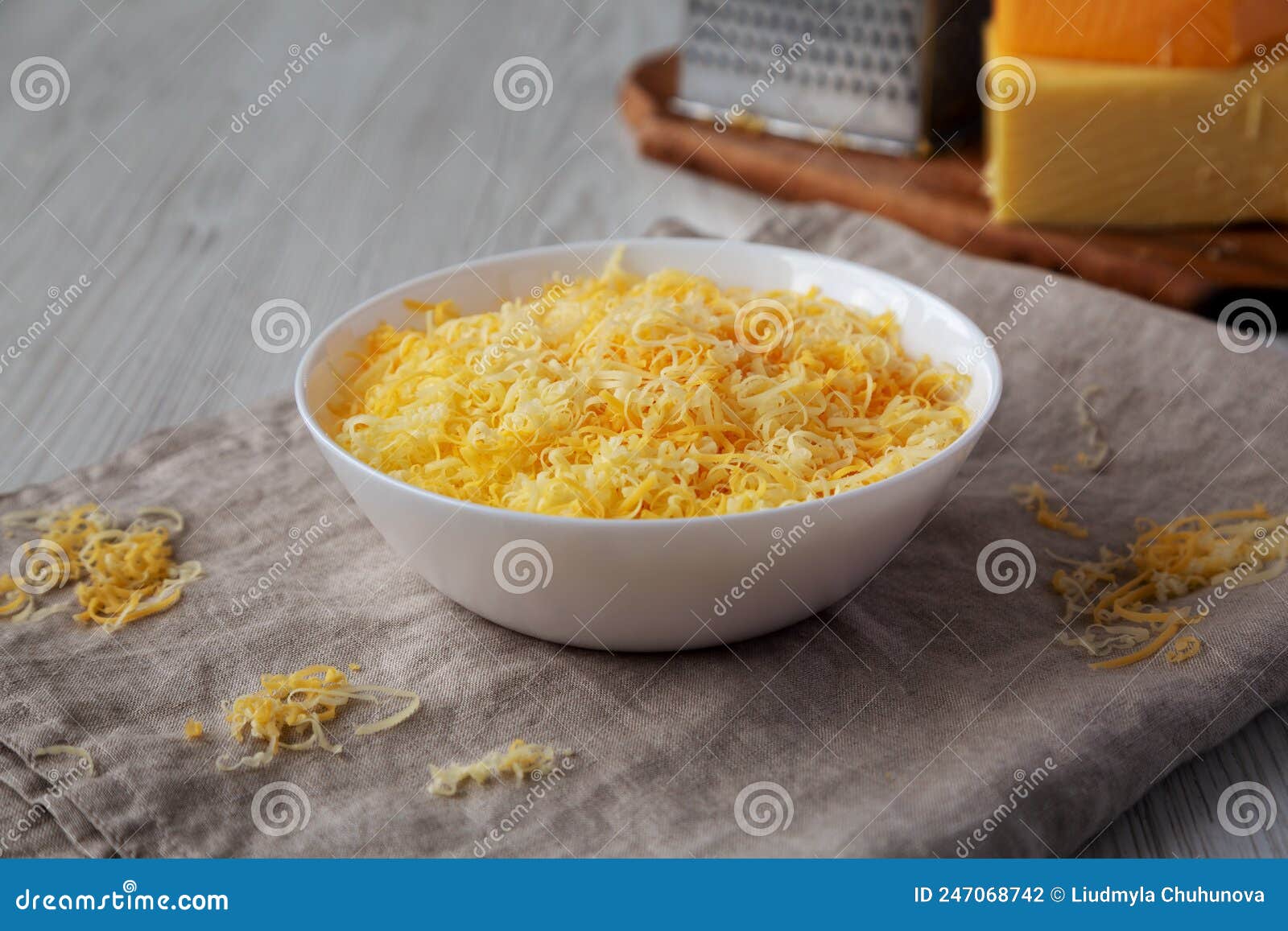 Shredded Mexican Cheese Mix in a White Bowl, Side View Stock Photo ...