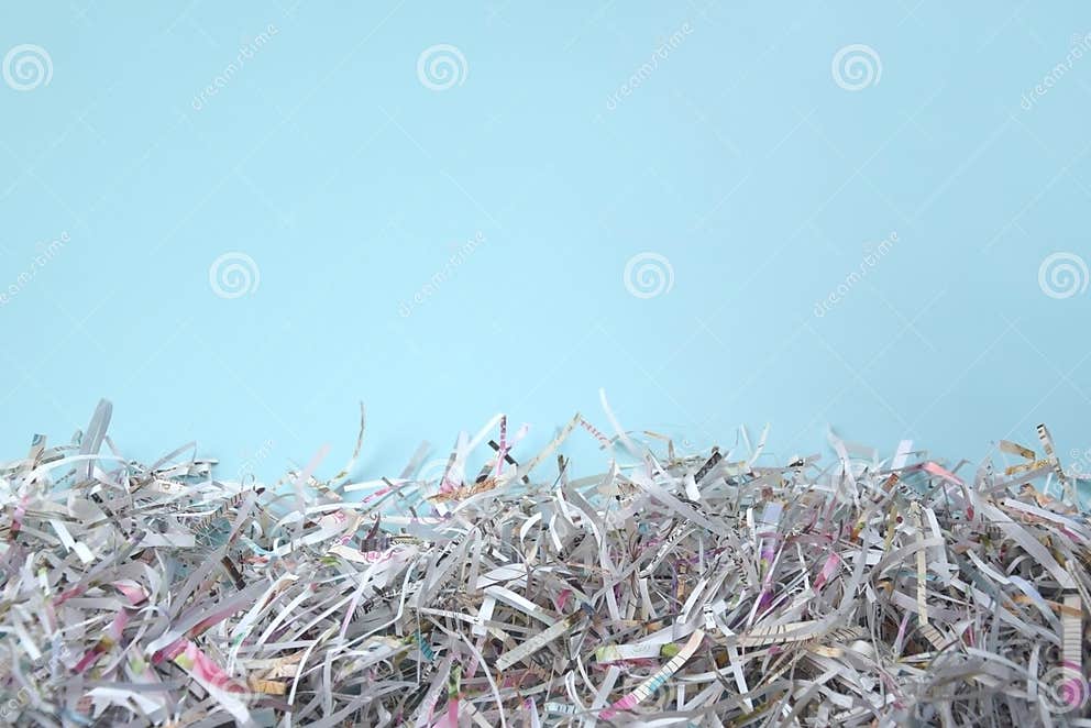 The Shredded Paper on Light Blue Background. Stock Image - Image of ...