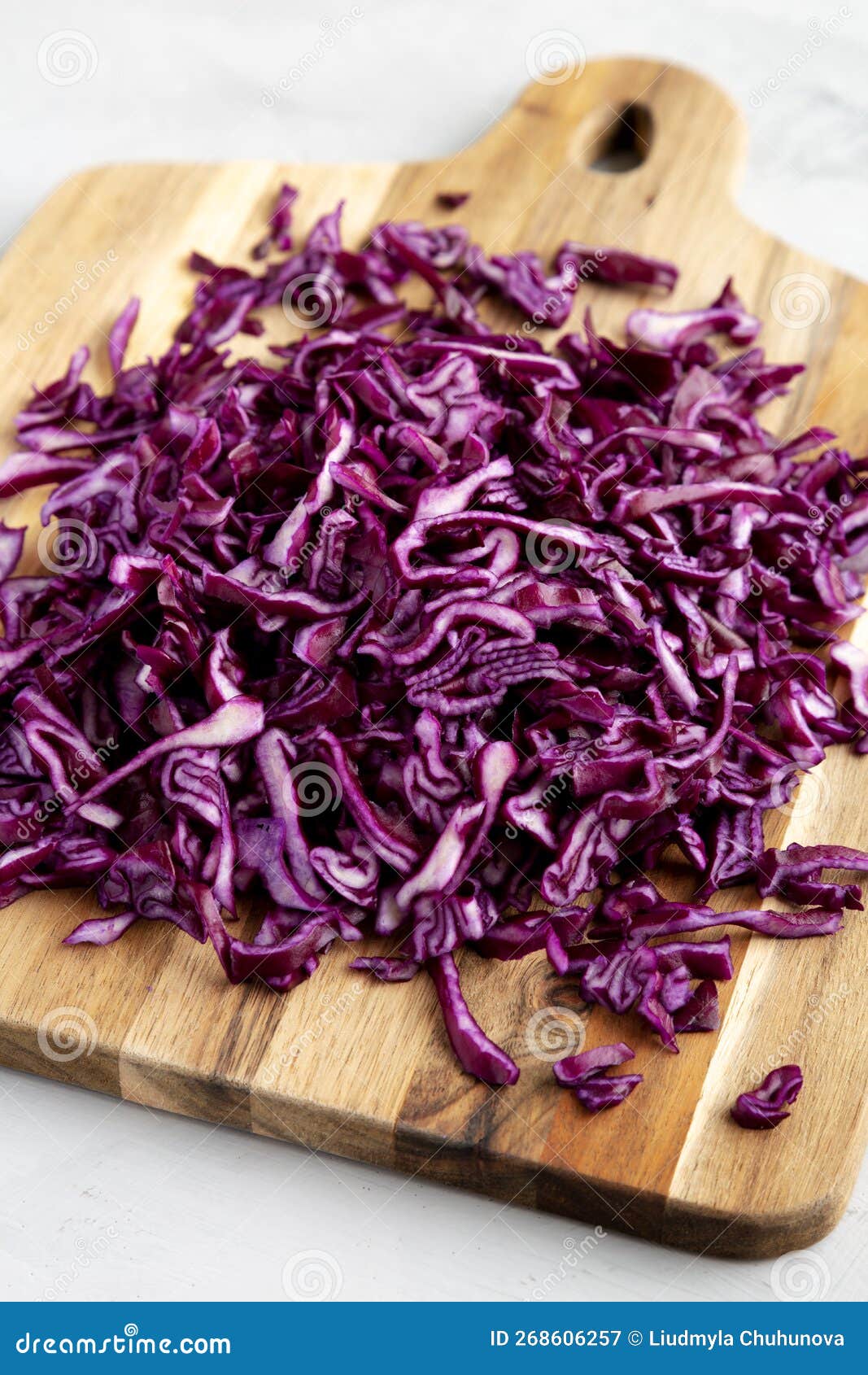 Shredded Purple Cabbage on a Board, Low Angle View. Close-up Stock ...