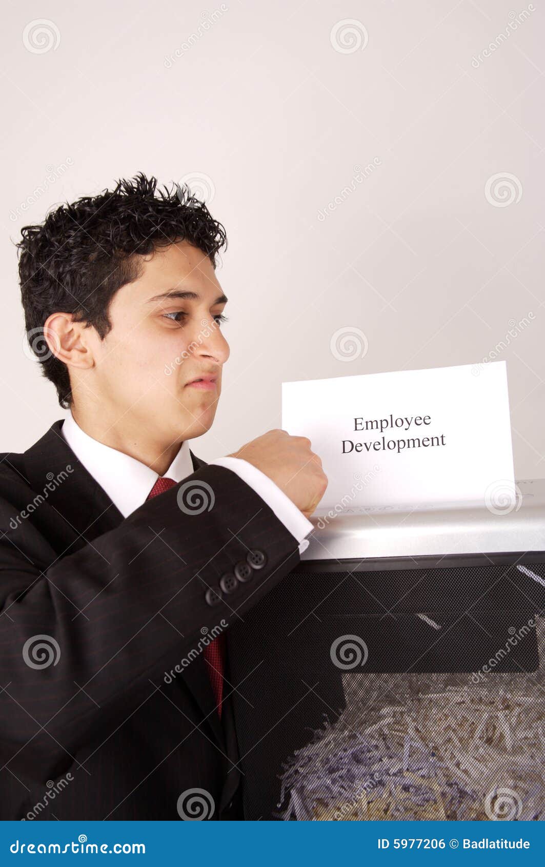 Shredding an Employee Development Plan Stock Photo - Image of male ...