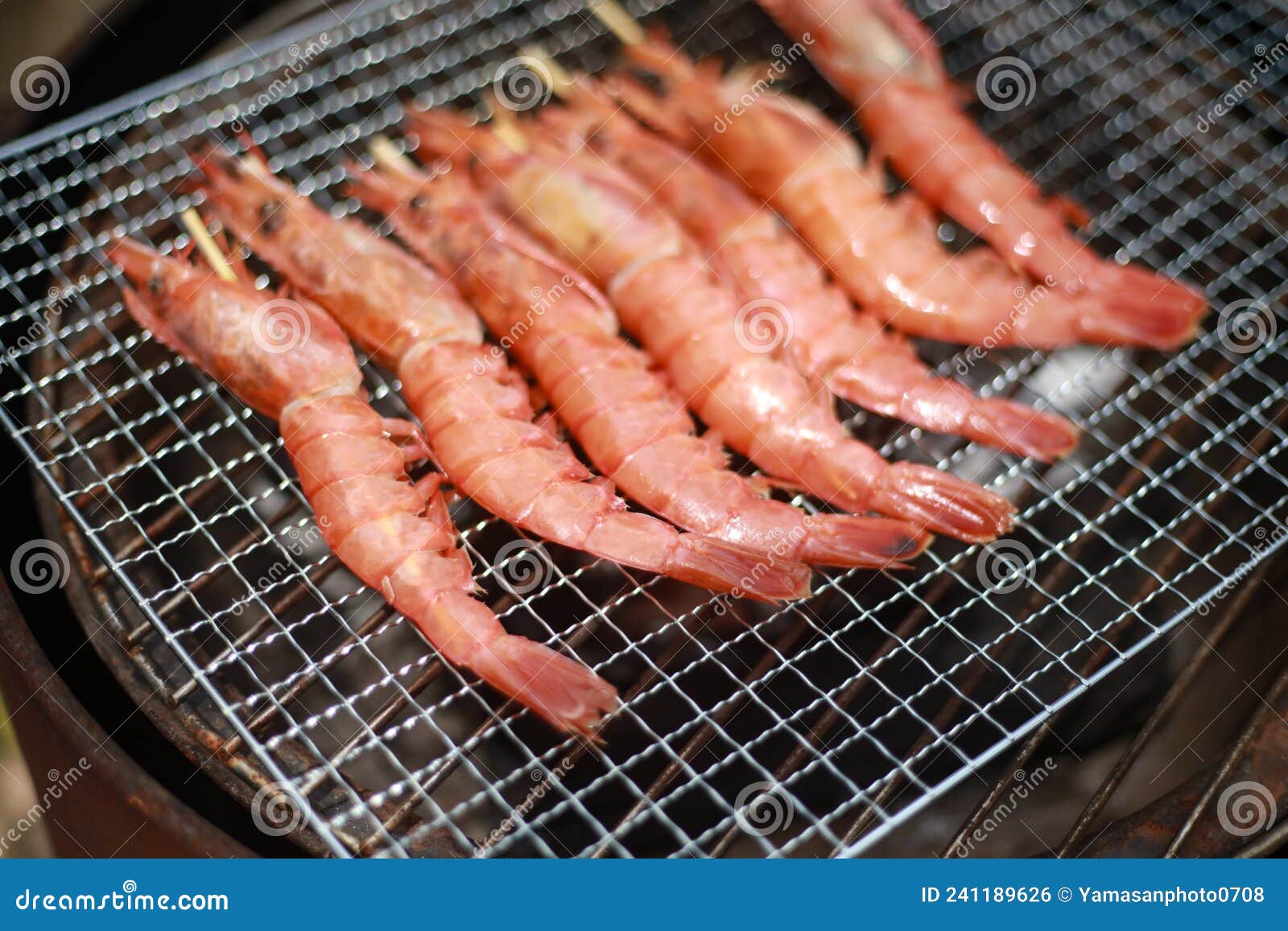 Shrimp grilled with a net stock photo. Image of home - 241189626