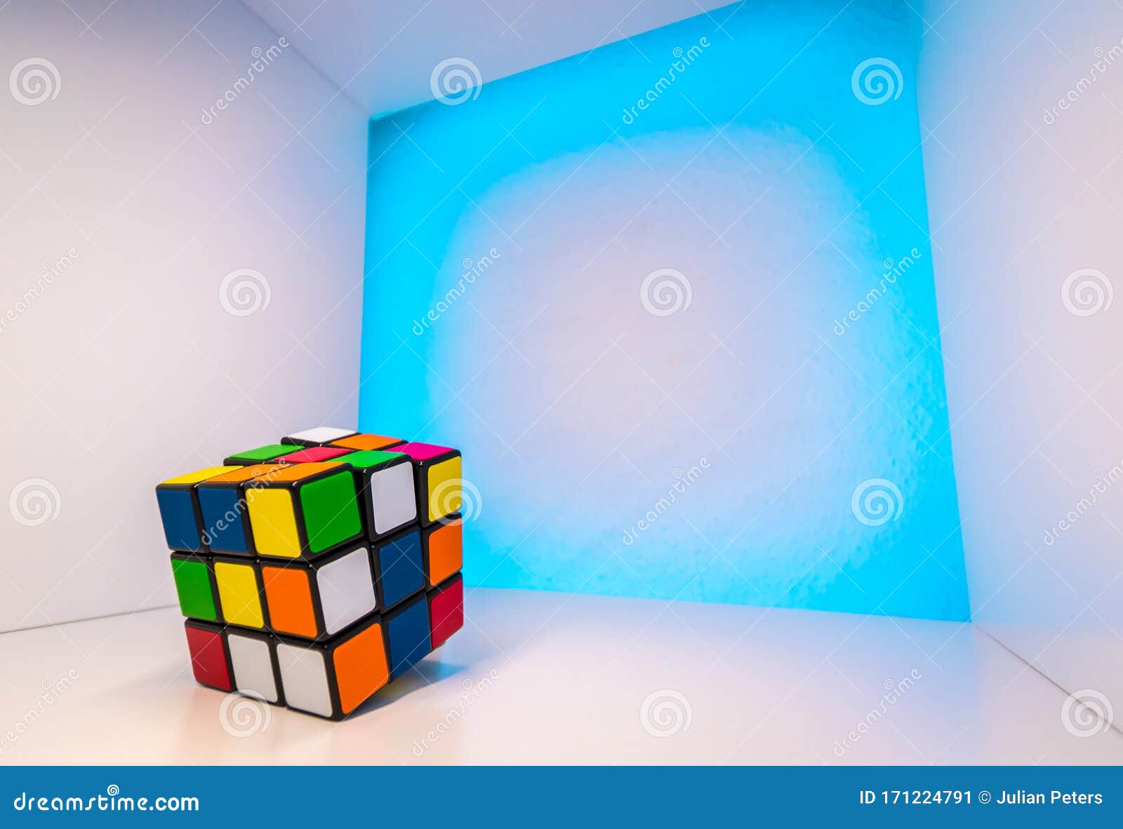 Shuffled Rubik`s Cube Inside a Cube with Light Blue Background ...