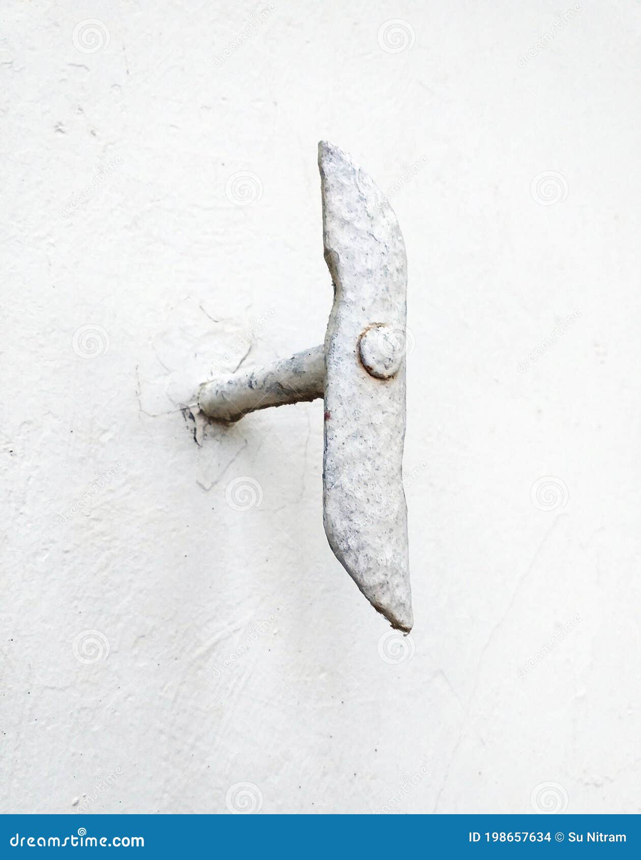 Shutter Hook on White Concrete Wall. White Painted Iron Bracket To Fix ...