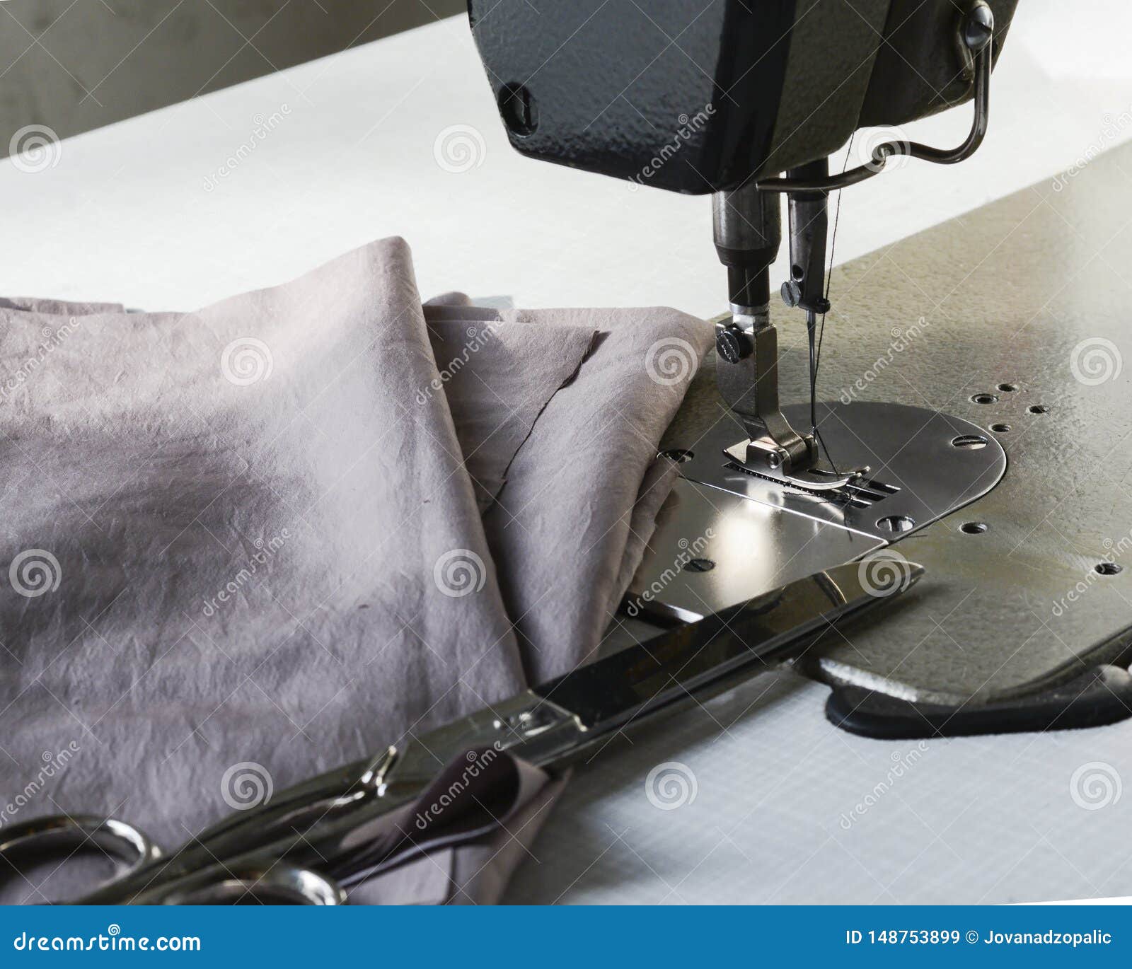 Shuttle with a Needle. Close-up of Sewing Machine and Scissors in a ...