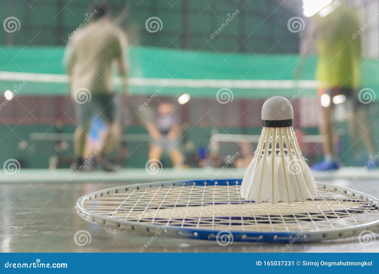 Shuttlecock Resting on a Badminton Racket with Badminton Player are ...