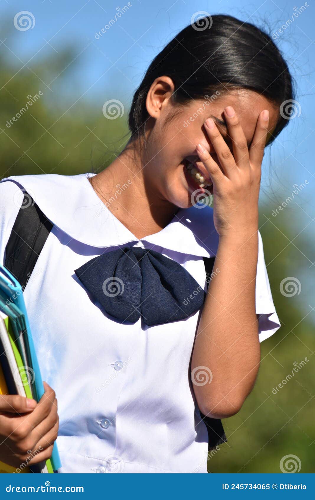 A Shy Female Student Holding Books Stock Image - Image of pupil ...