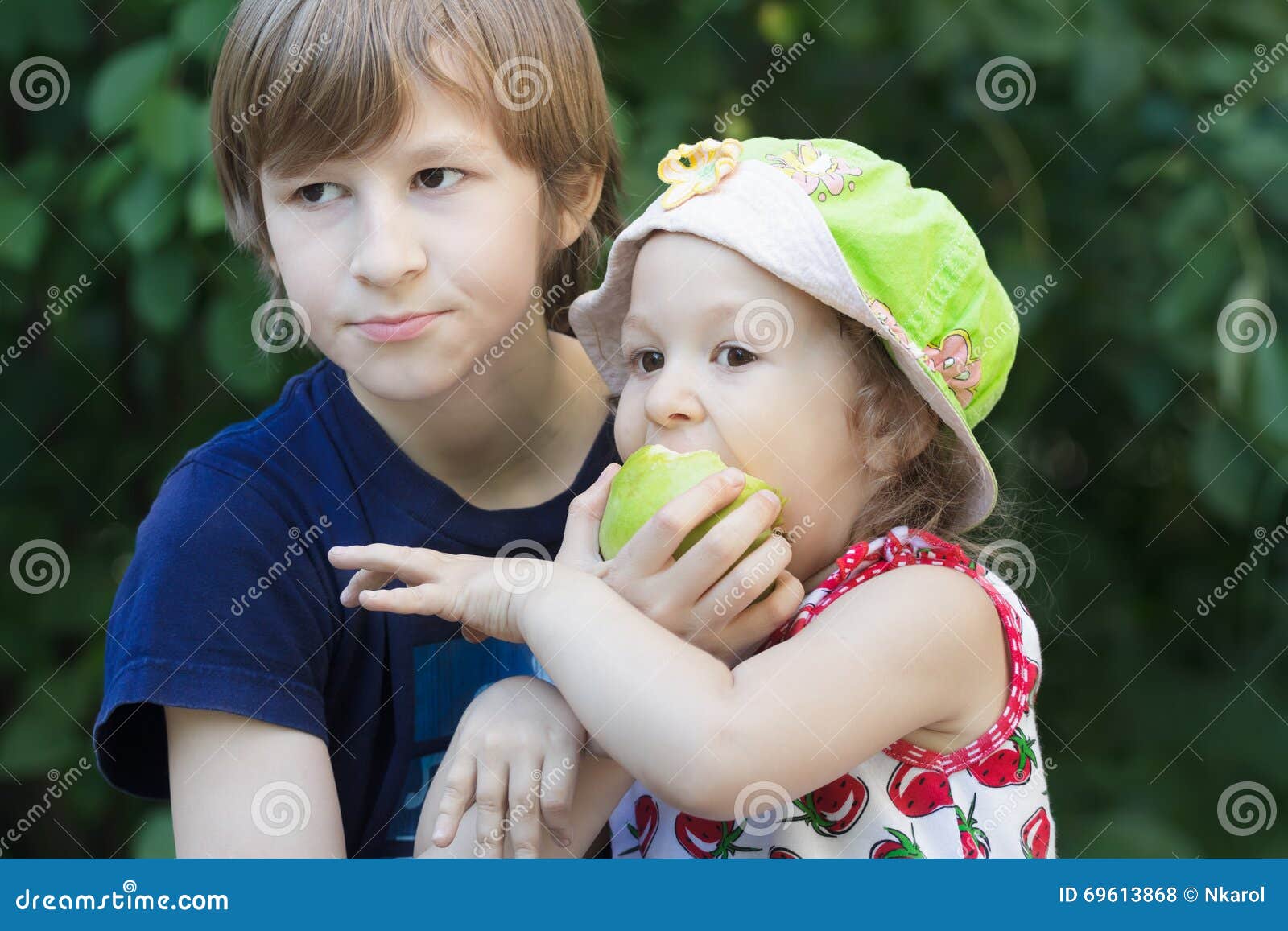 Sibling Children Sharing Green Apple Fruit Outdoor Stock Photo - Image ...