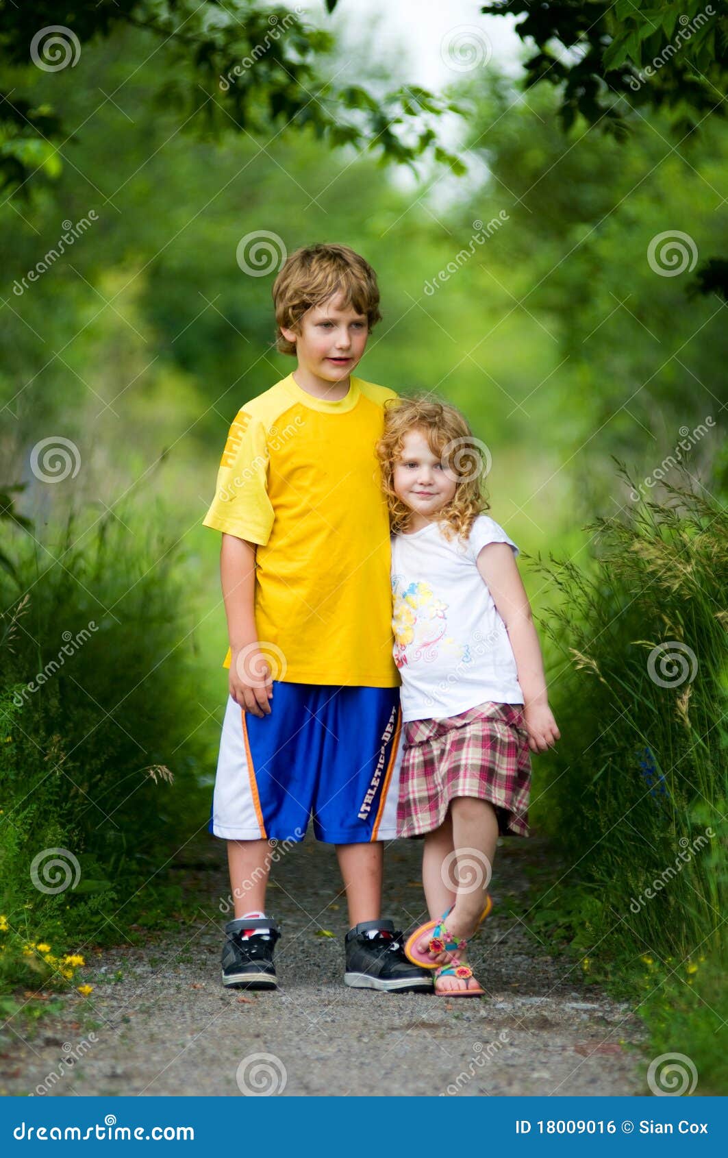 Siblings stock photo. Image of lifestyle, green, grass - 18009016