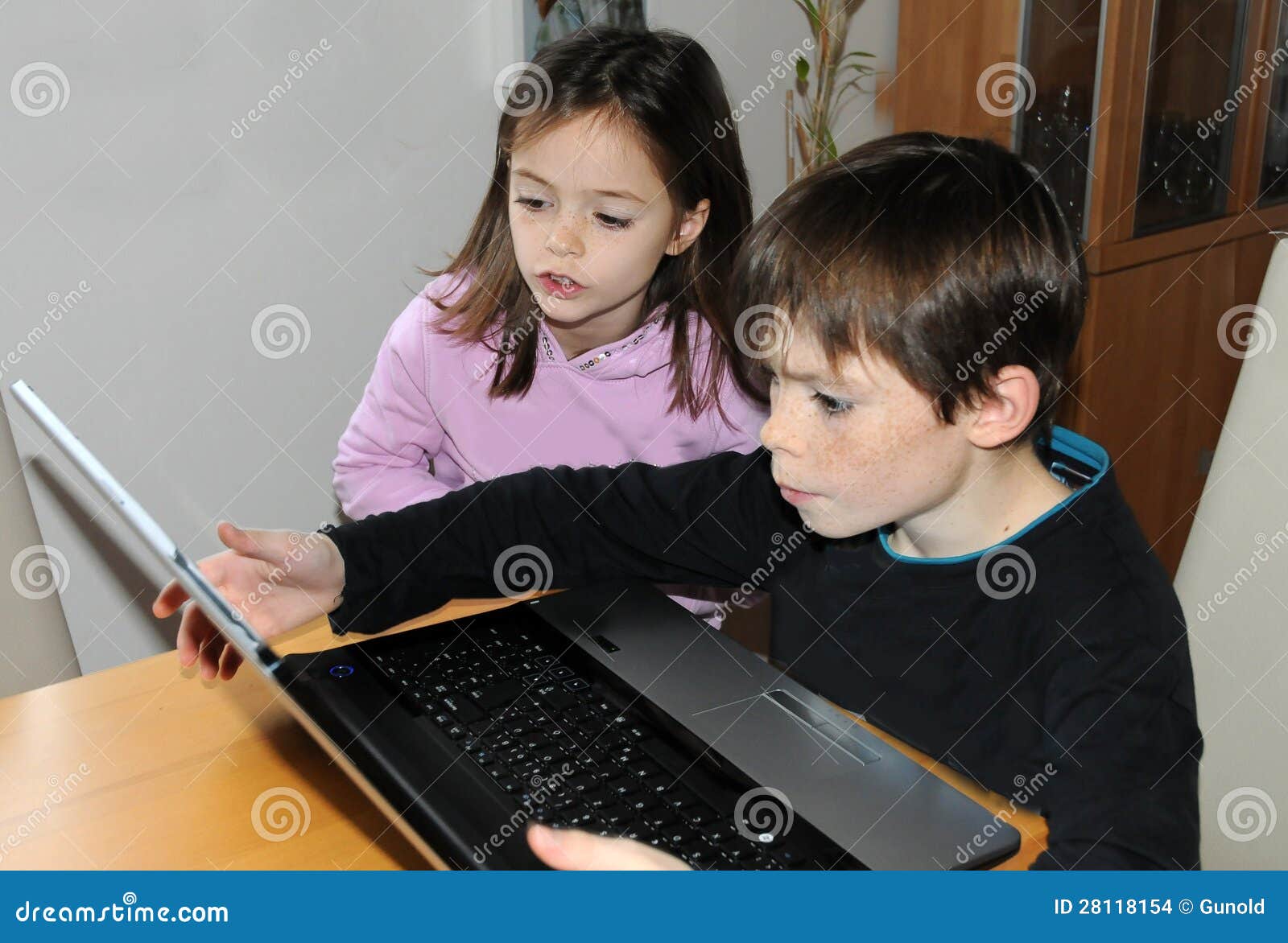 Siblings with computer stock photo. Image of computer - 28118154