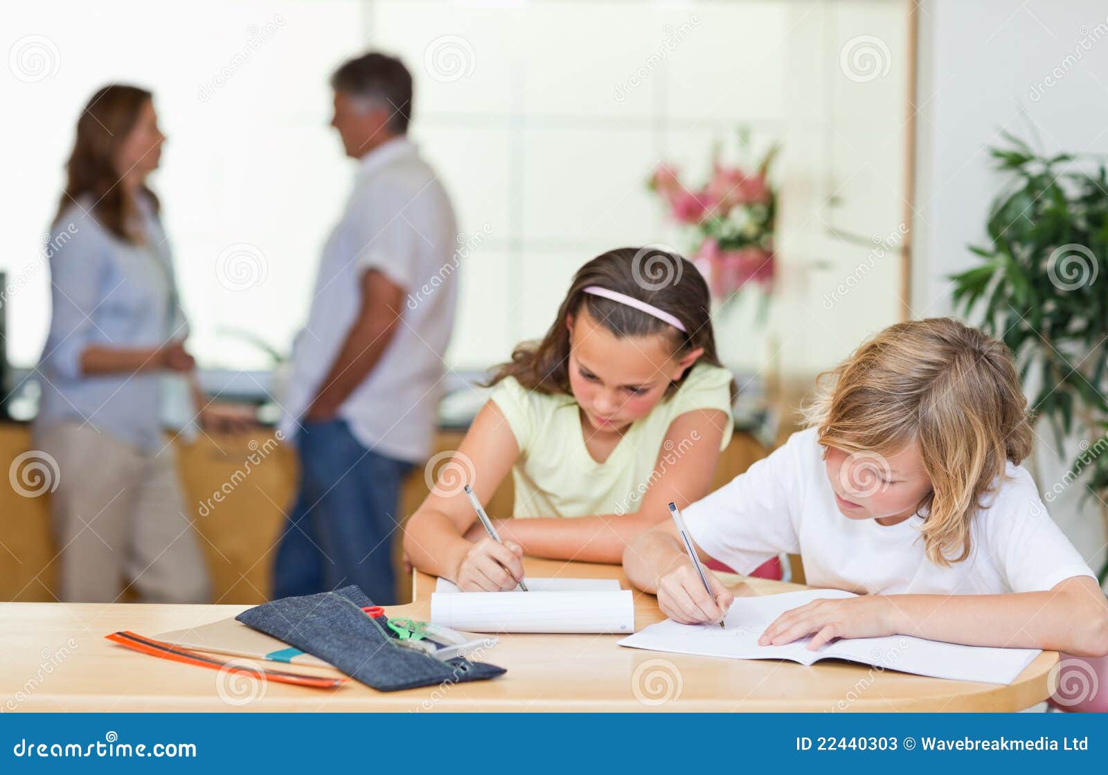 Siblings Doing Homework with Parents Behind Them Stock Image - Image of ...