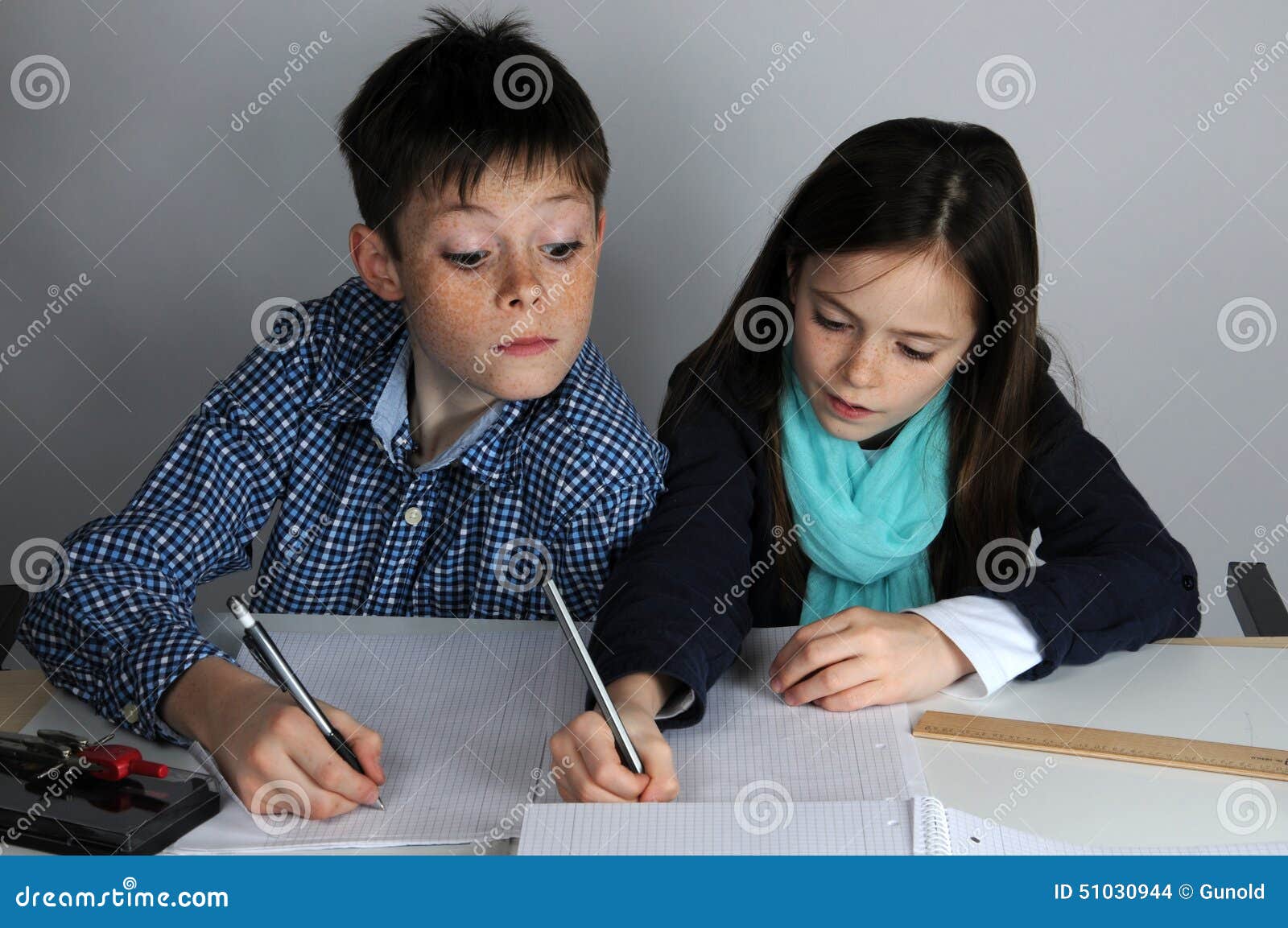 Siblings Doing School Homework Stock Photo - Image of caucasian ...