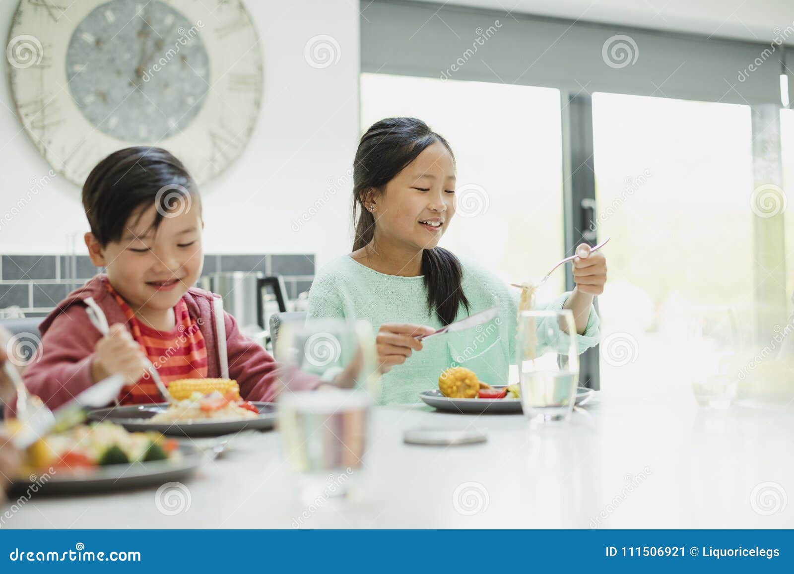 Siblings Enjoying Their Stir Fry Dinner Stock Image - Image of ...