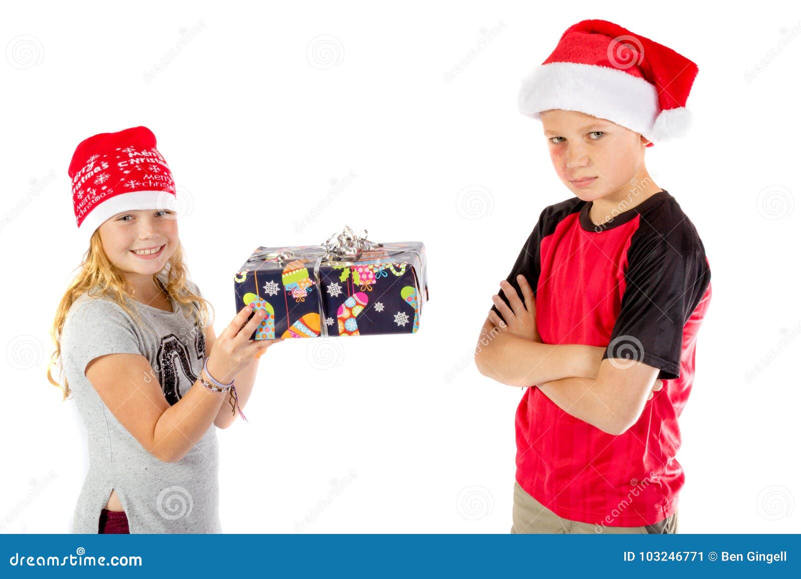Siblings Exchange a Christmas Present Stock Image - Image of sulking ...