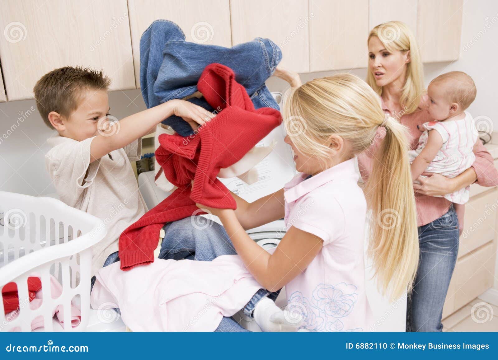 Siblings Fighting while Doing Laundry Stock Photo - Image of laundry ...